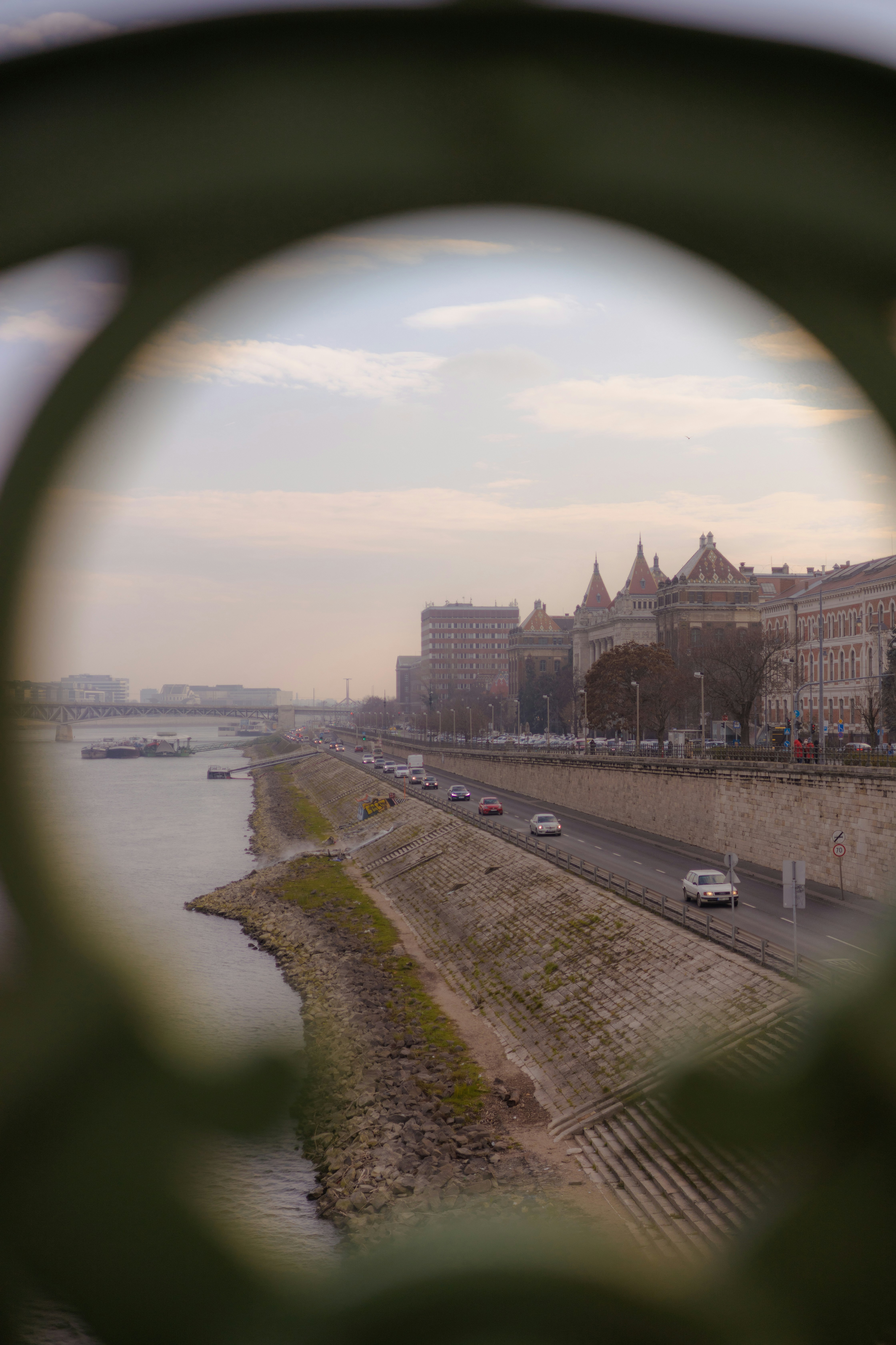 Through the Arch: City Riverfront Framed by a Circular View