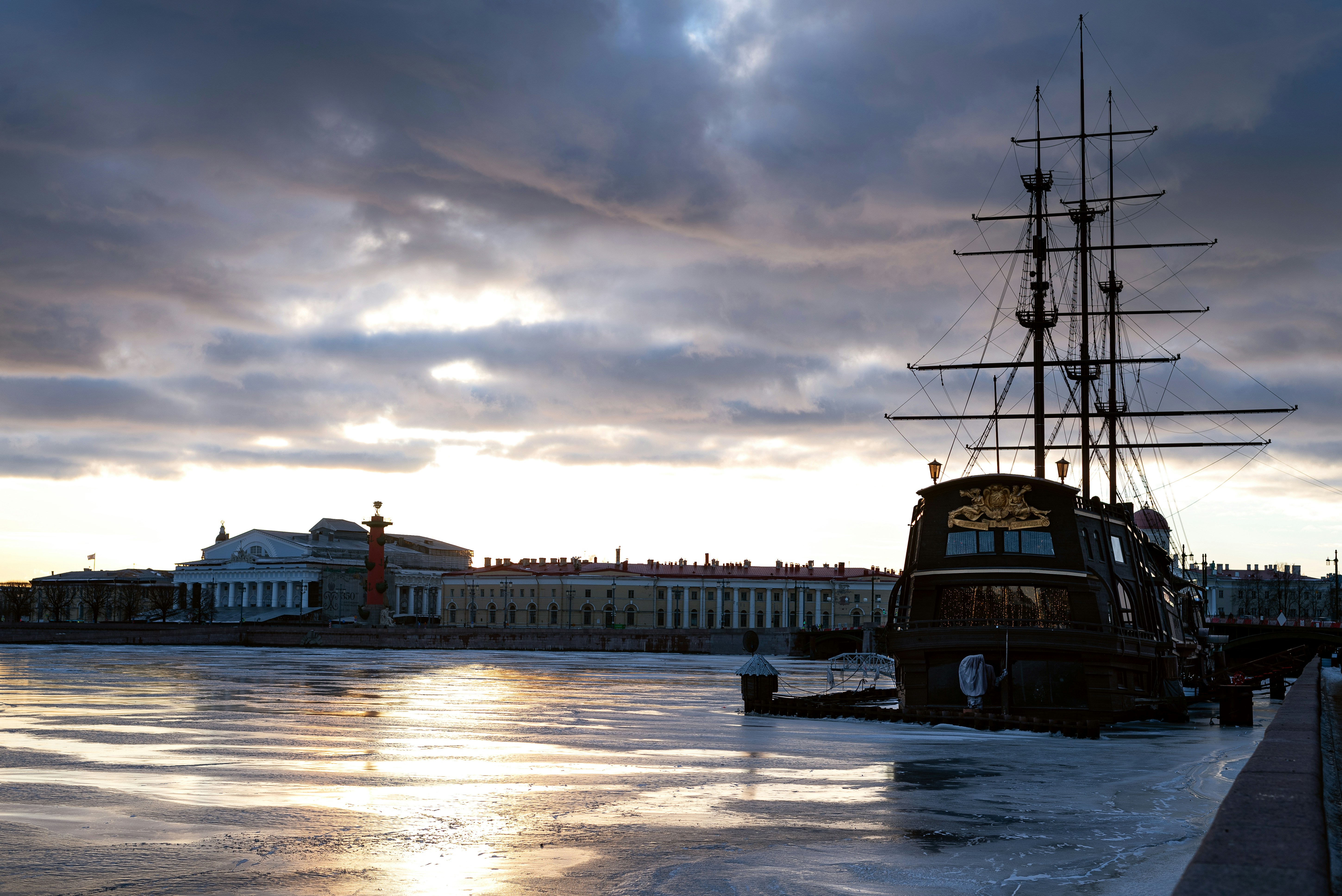 Old Harbor, Silver Skies: A Vessel at Dusk