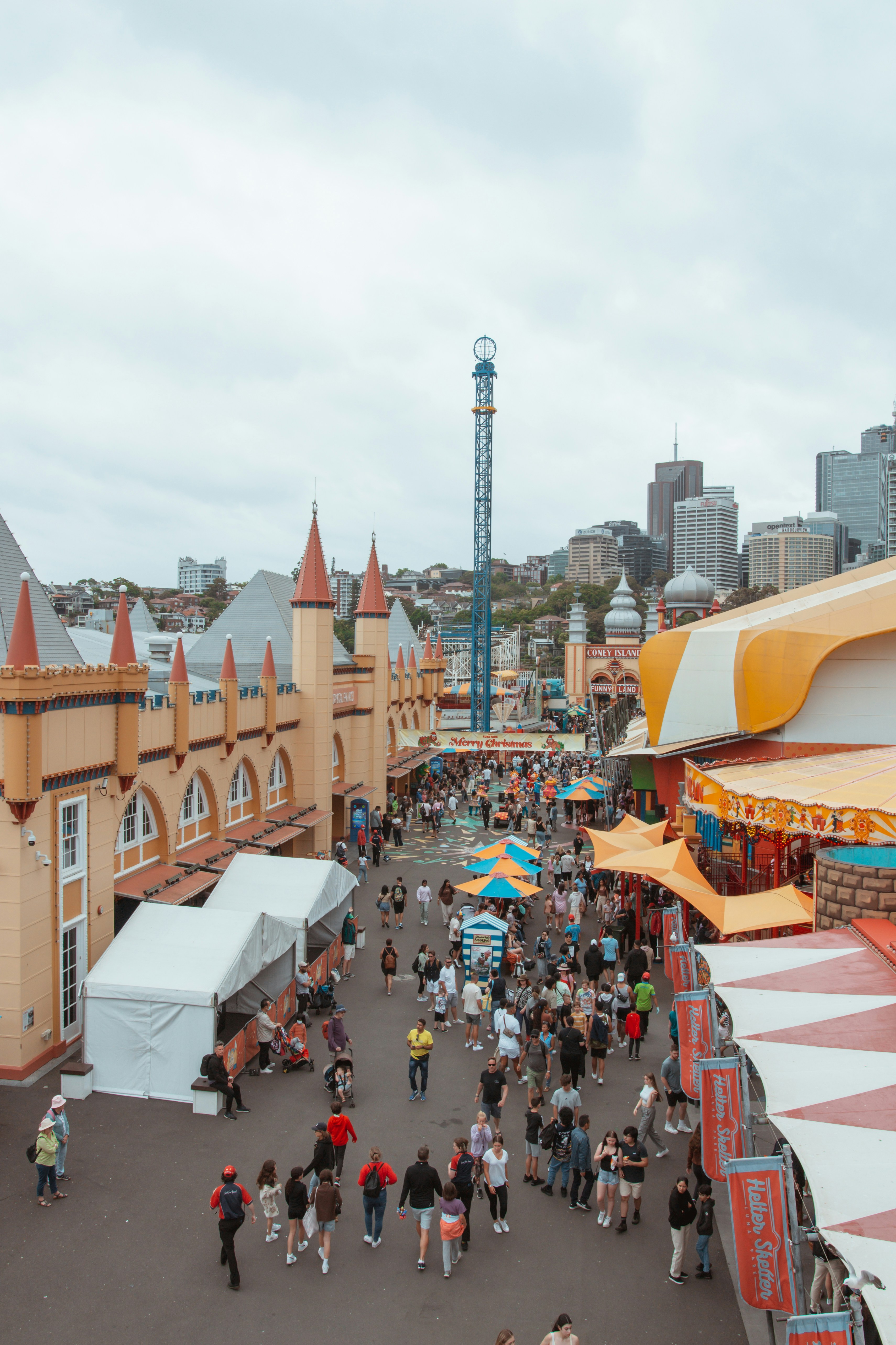 Castlefront Market Street: Crowds Thread Through Orange Canopies