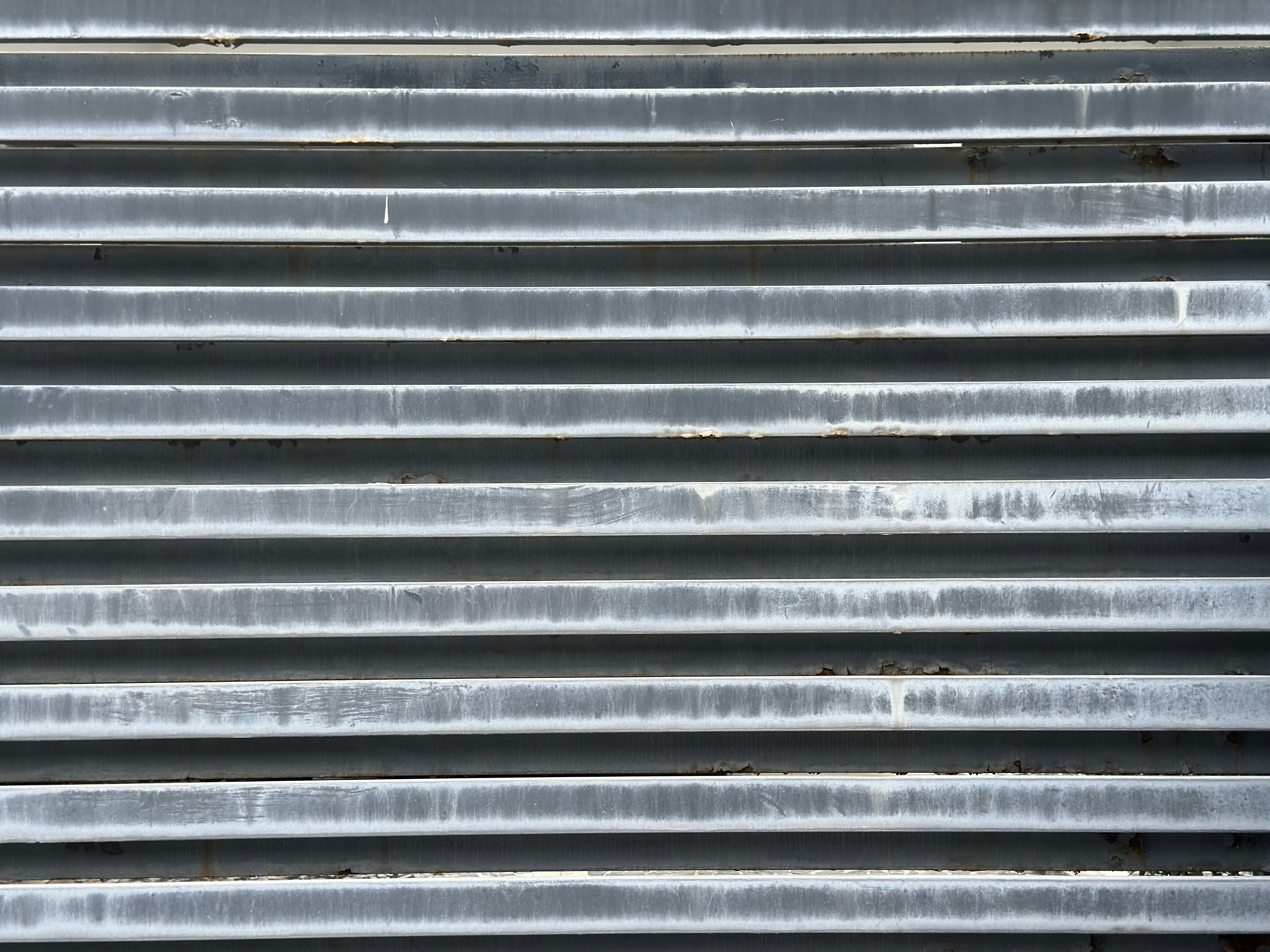 Old metal fence horizontal stripes of metal