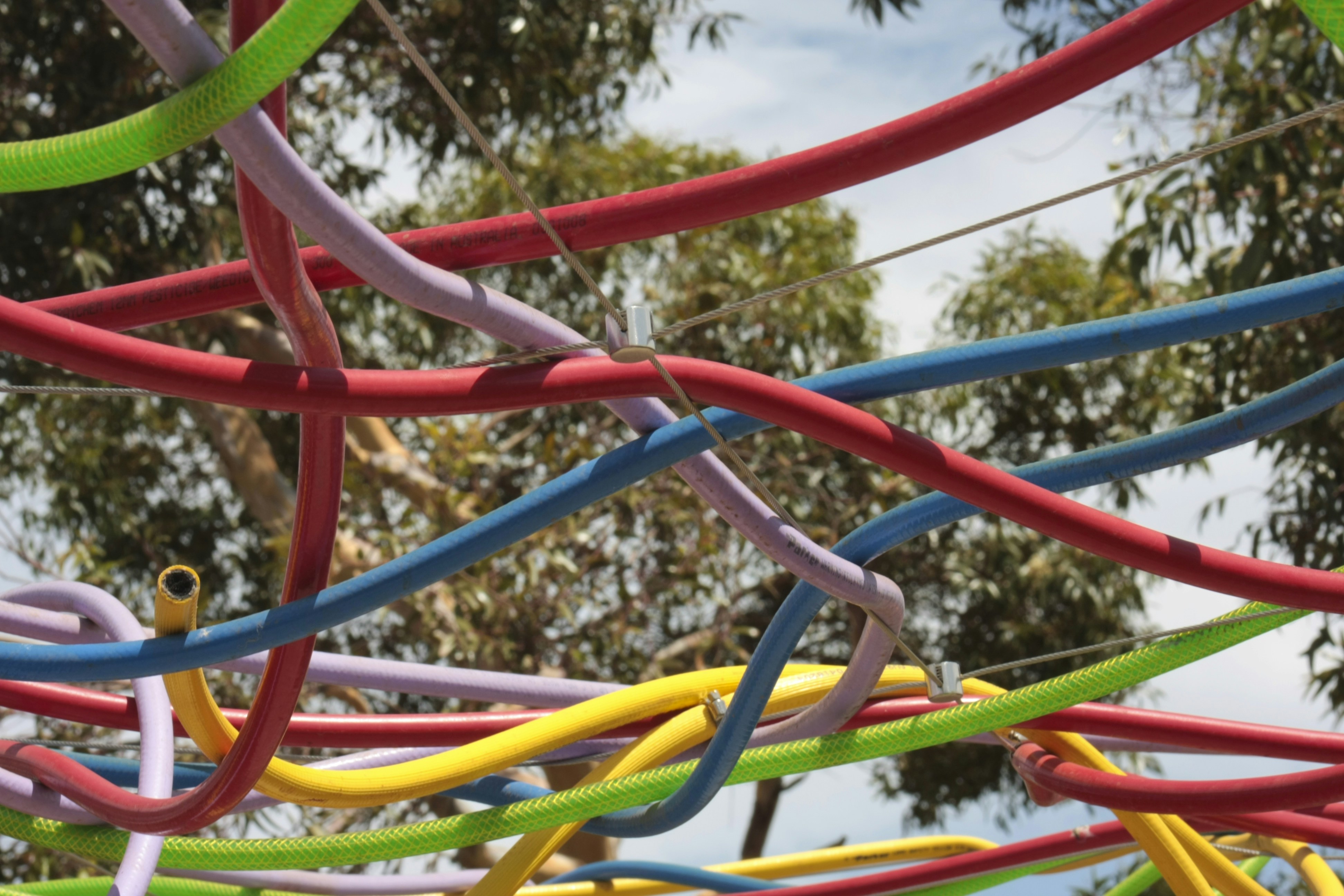 A close up of a bunch of colorful hoses photo – Free Jumbled Image on ...