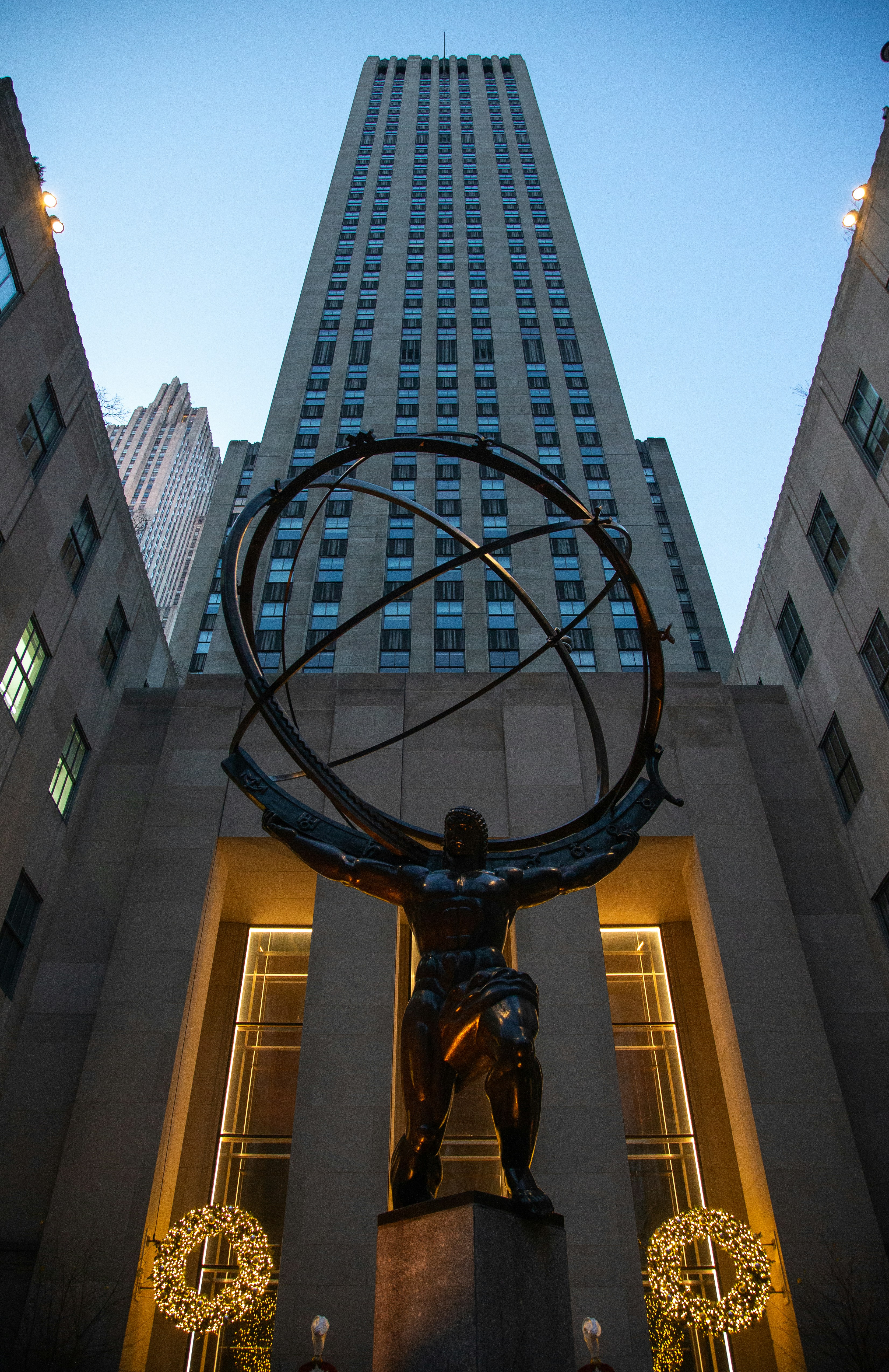Atlas Under Dusk: Armillary Sphere Framed by a City Gate