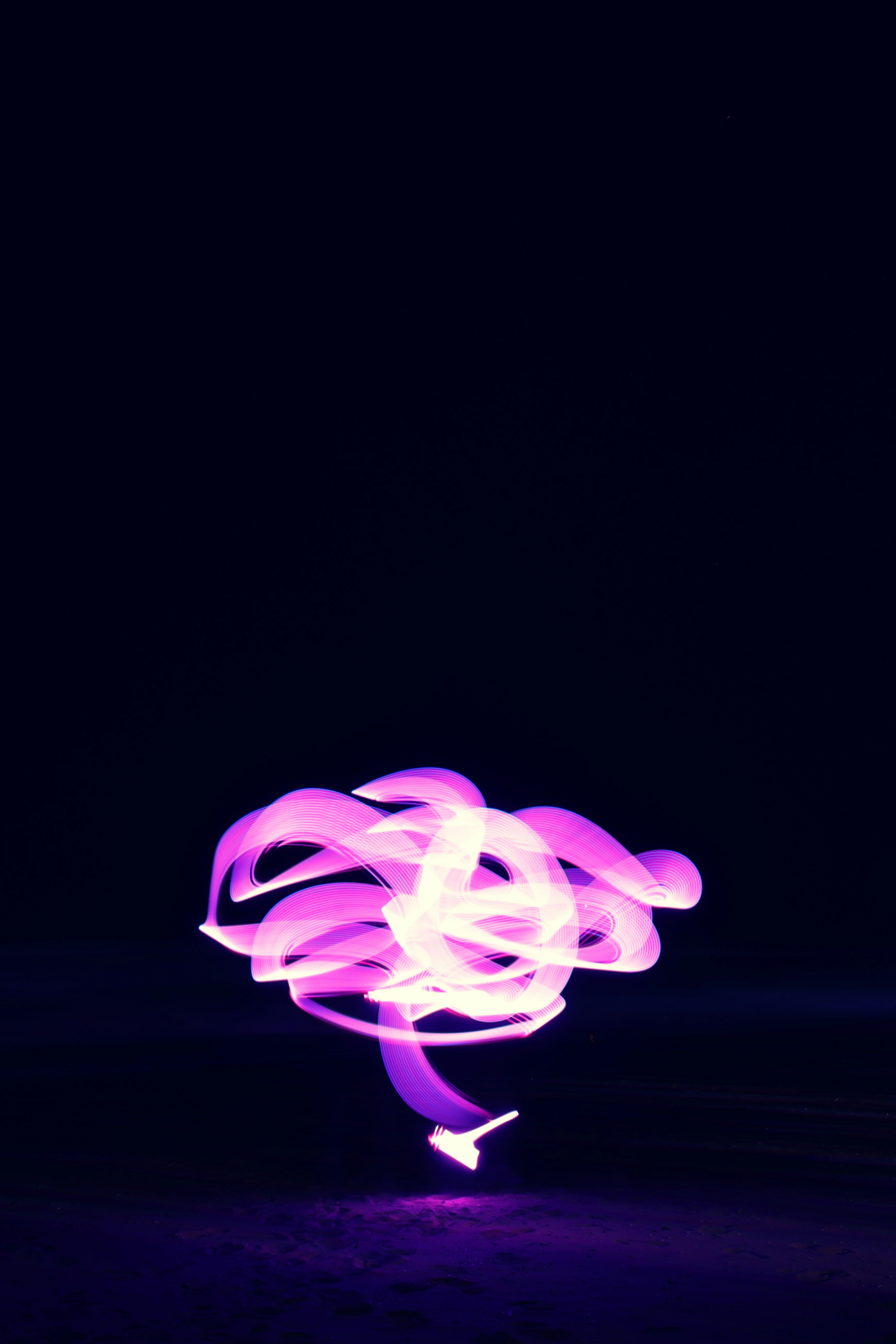 Purple Whorl Over the Quiet Shore: A Nighttime Light-Painting Session