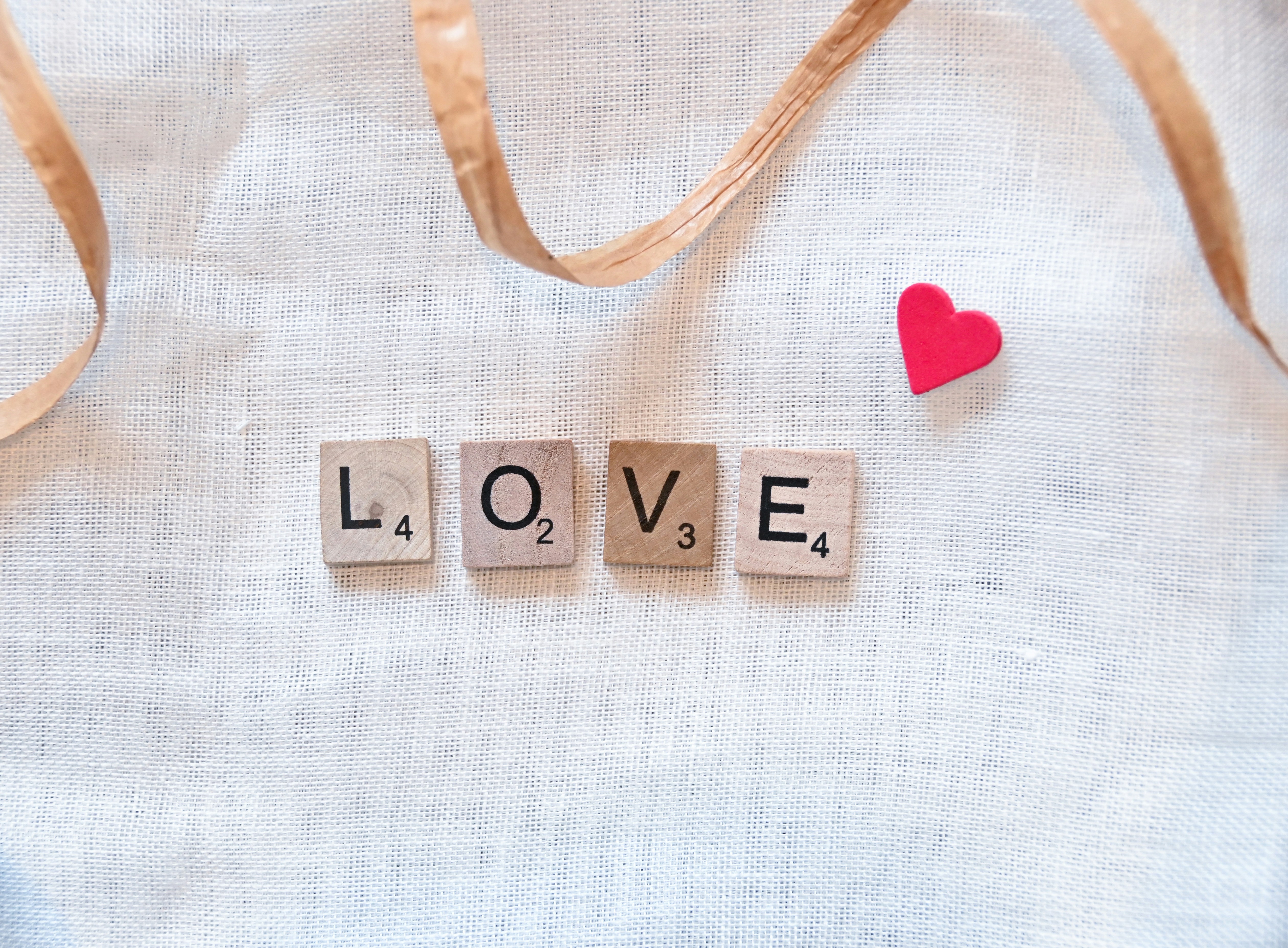 The word love spelled with scrabbles and a red heart photo – Free Love ...