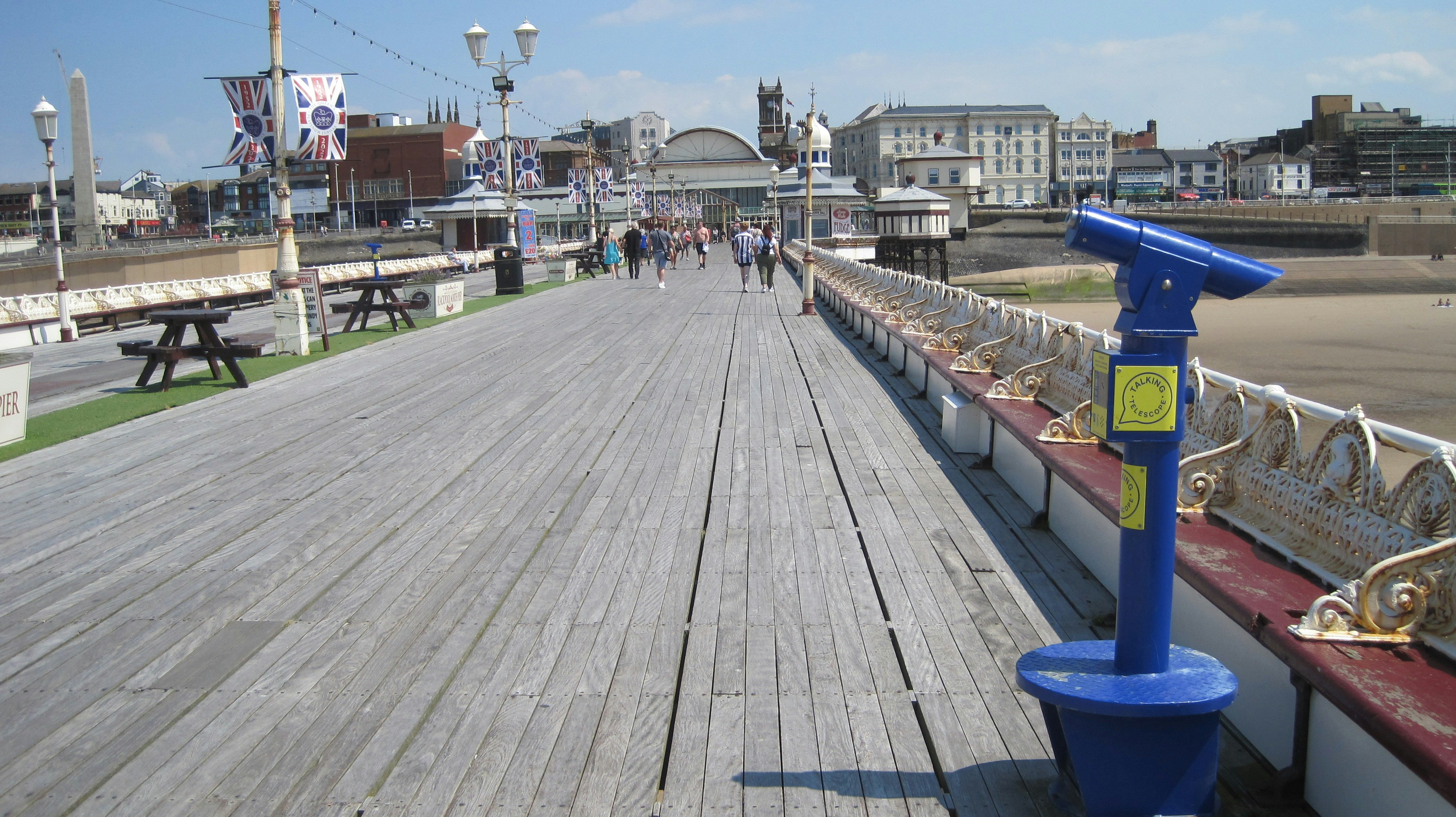 A wooden pier with benches and benches on it photo – Free Blackpool ...