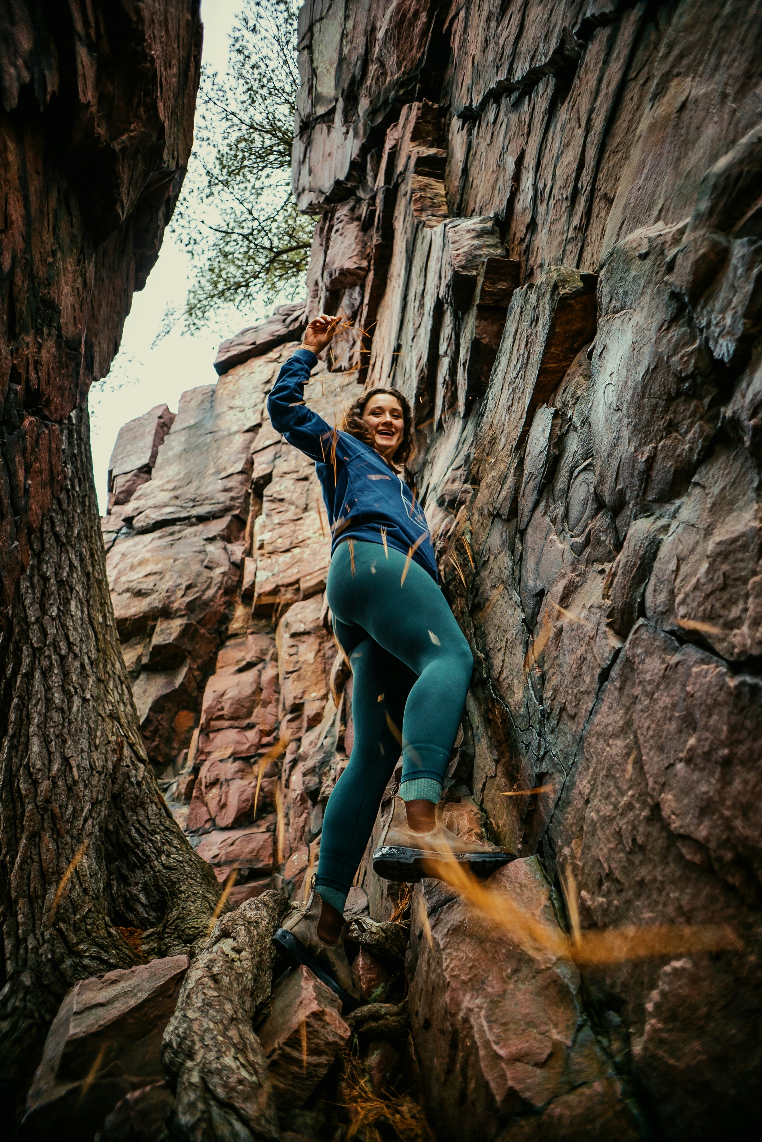 Between Granite Giants: A climber finds balance in a narrow canyon crevasse