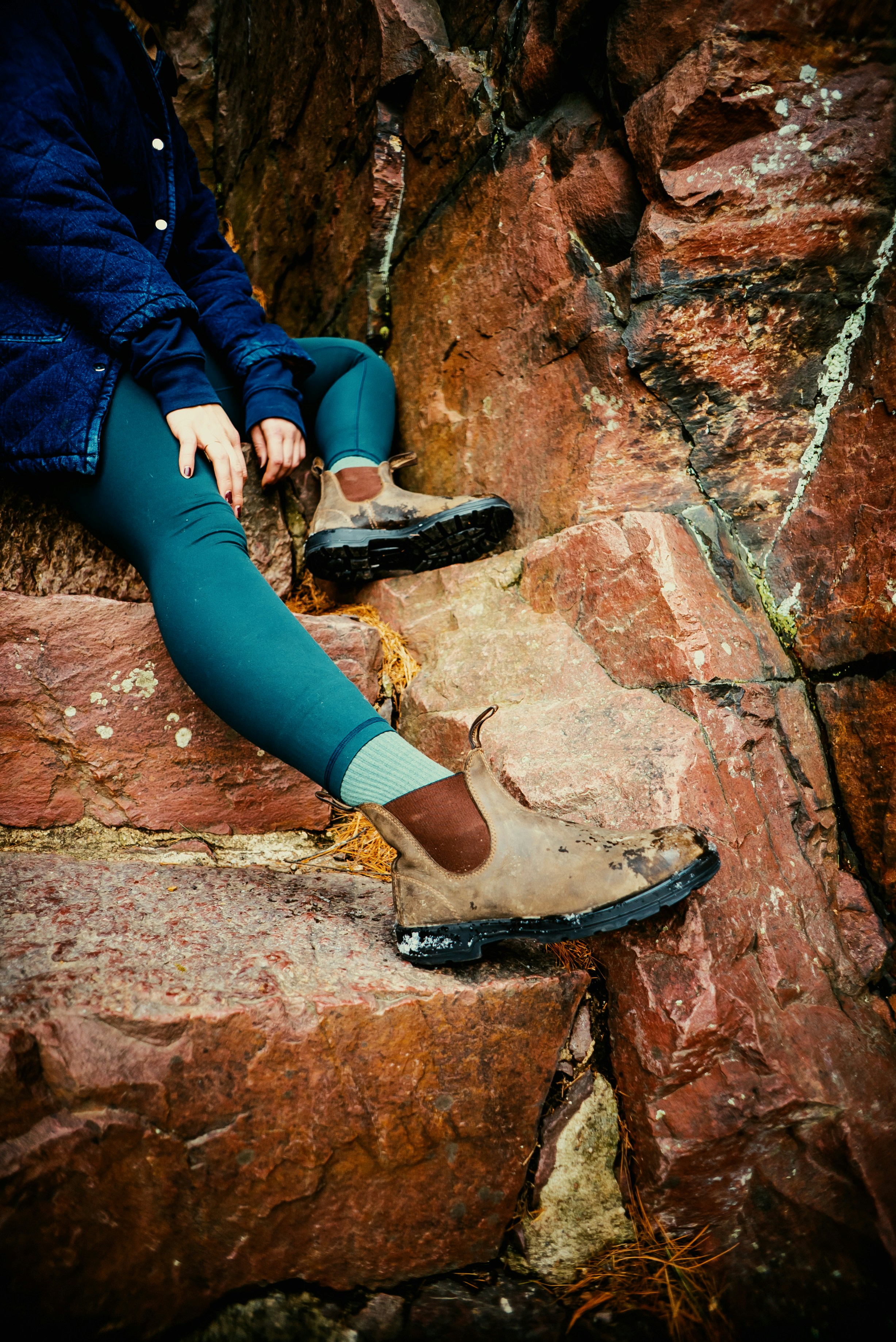 Booted Pause on Weathered Red Rock