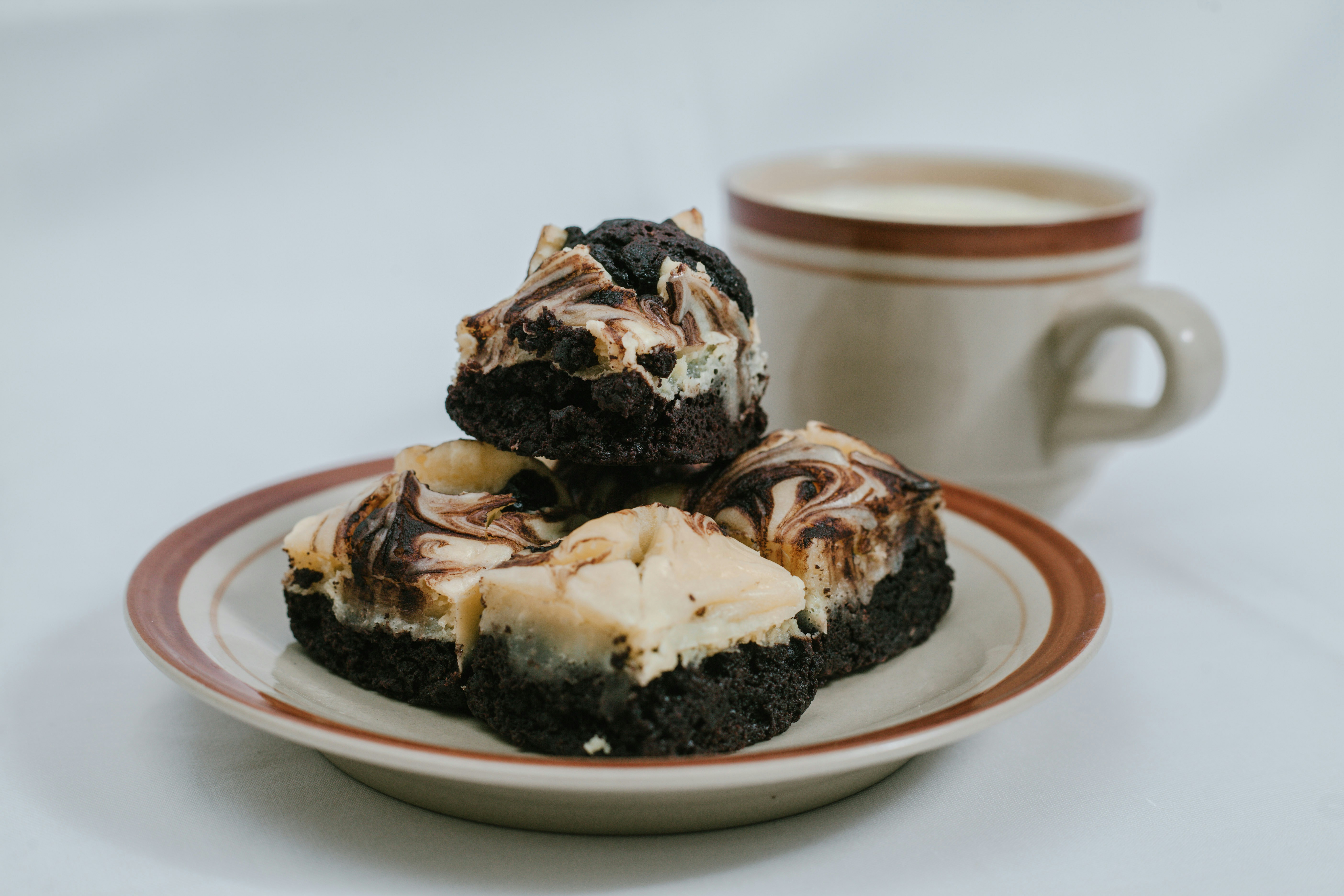 Cream-Swirled Dark Chocolate Brownies on a Quiet Plate