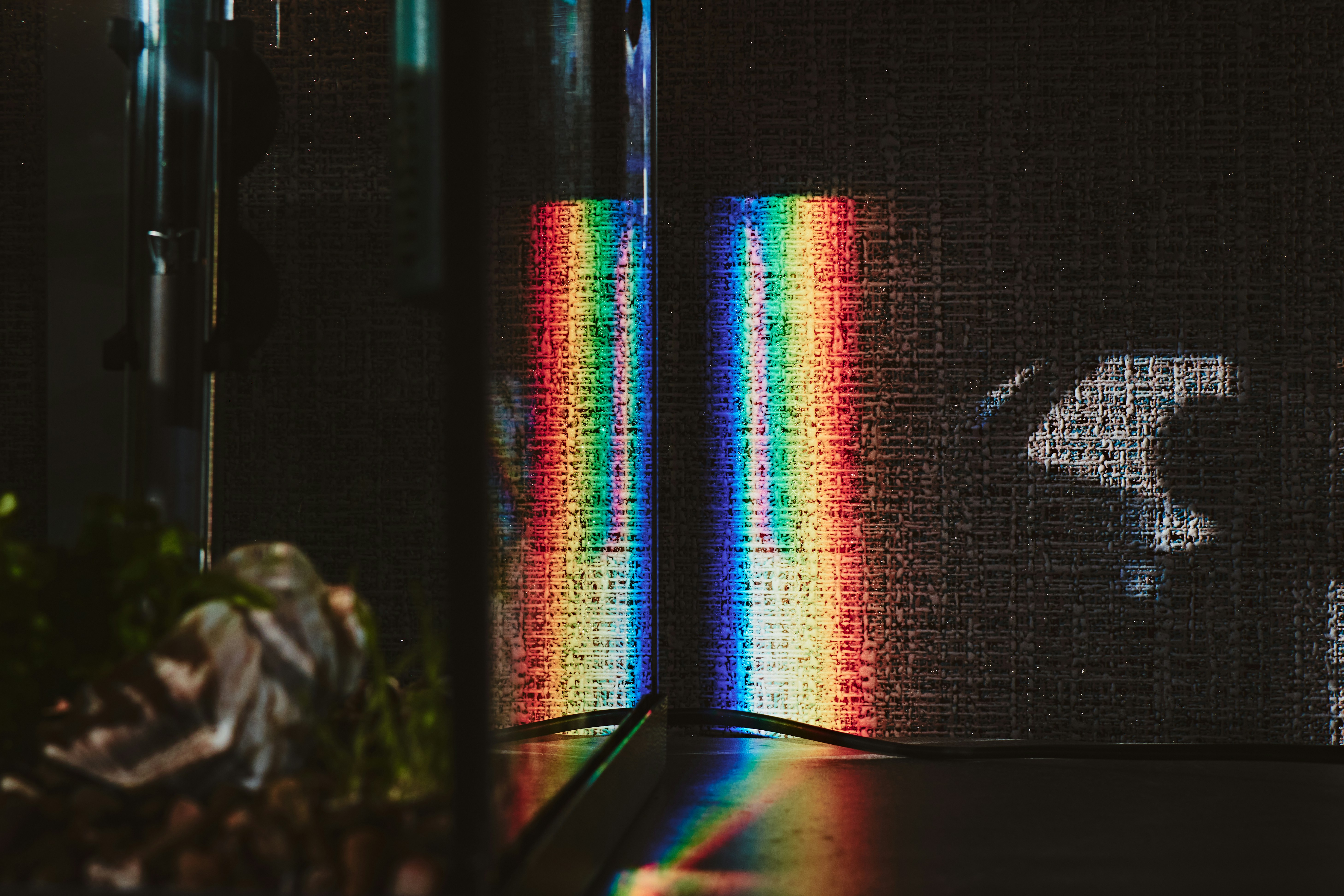 a picture of a rainbow painted on the side of a building