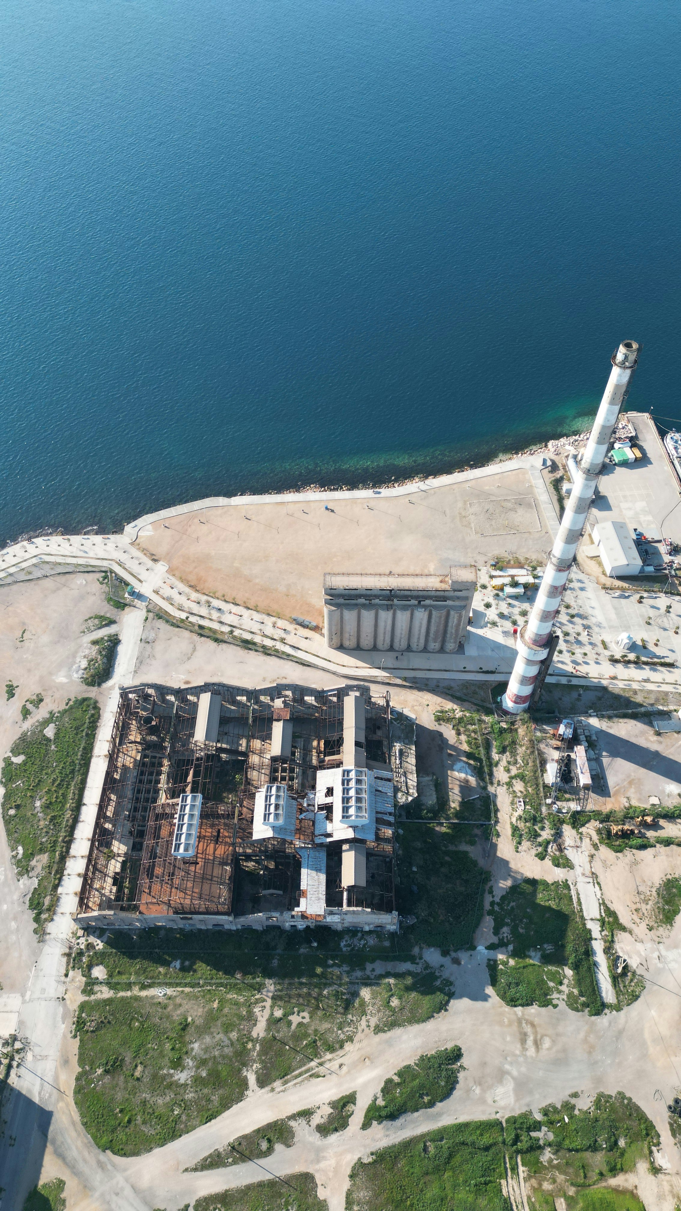 Industrial Chimney Overlooking a Coastal Factory Grounds