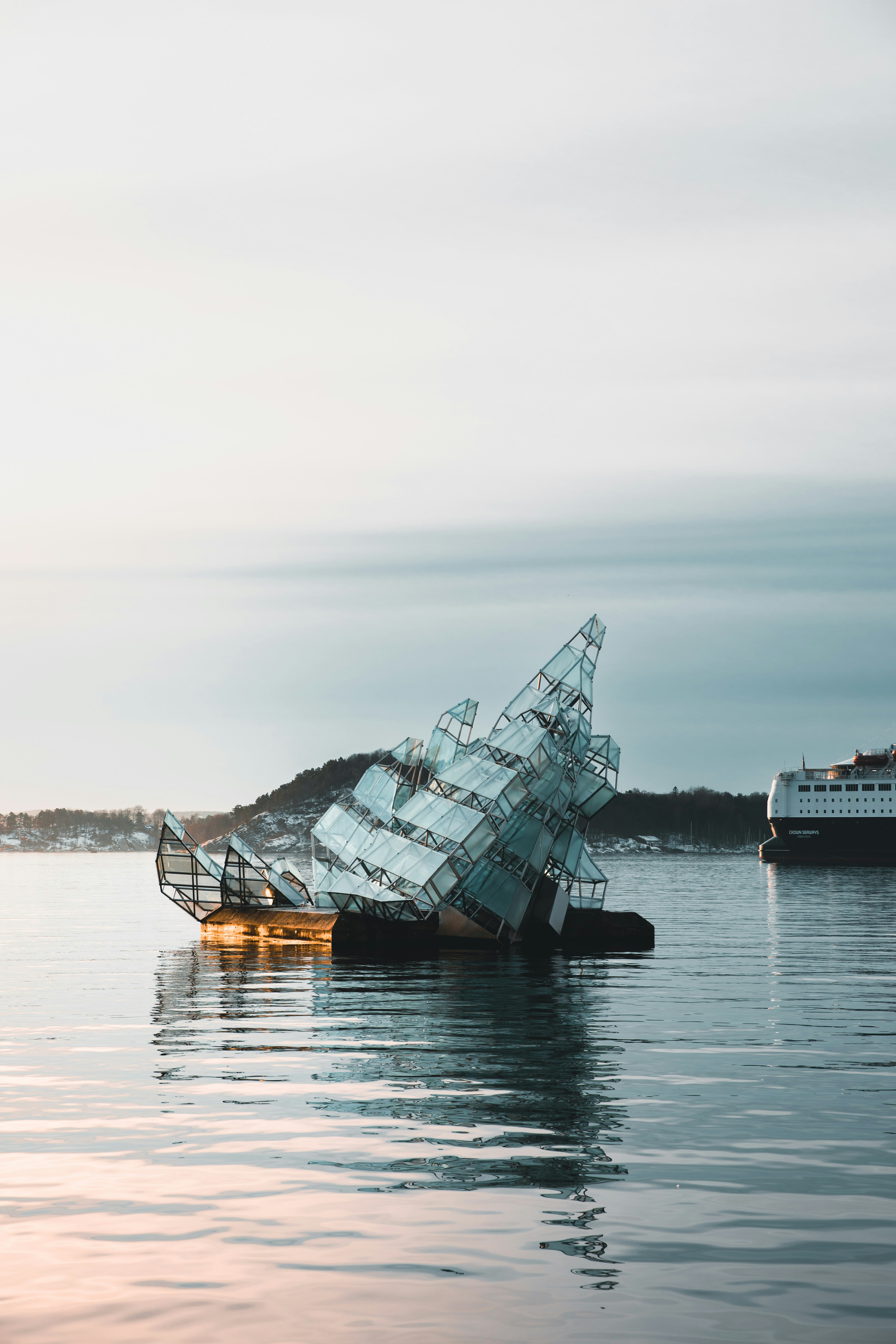 Glacier Shipyard: Tilted Glass Munnel in a Quiet Fjord