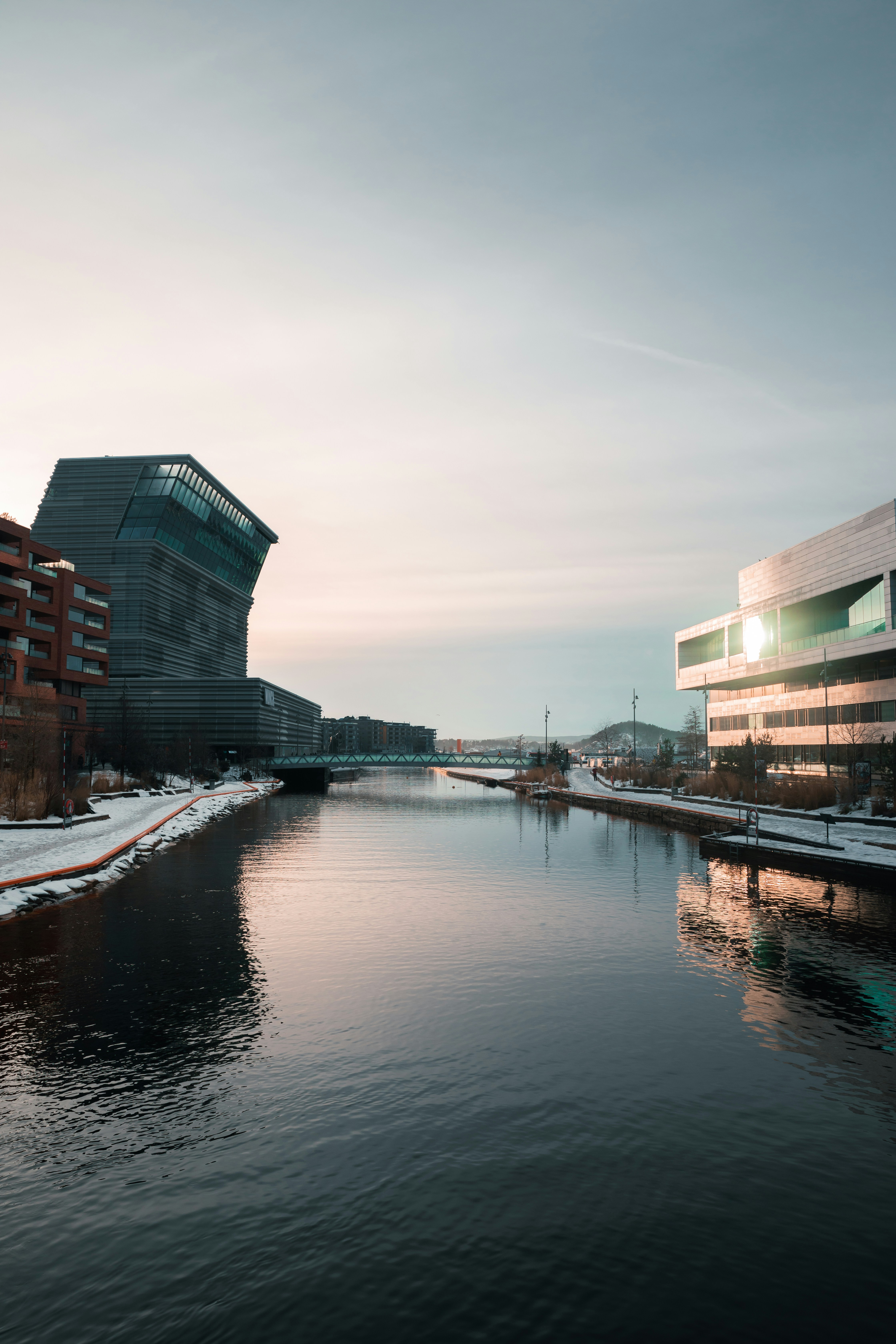 Winter Canal Geometry: Glass, Snow, and Water