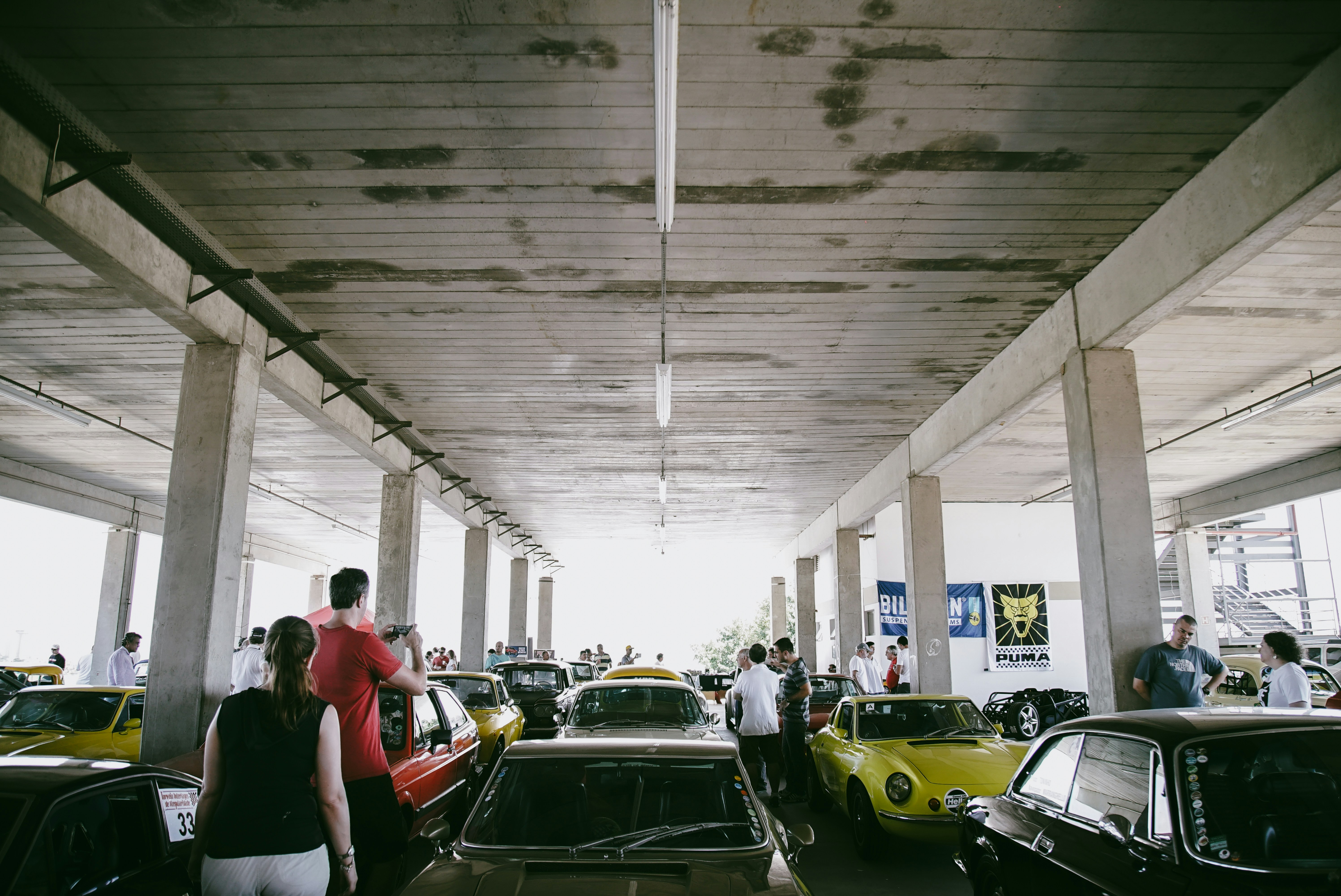 A group of cars parked under a bridge photo – Free Desktop wallpaper ...