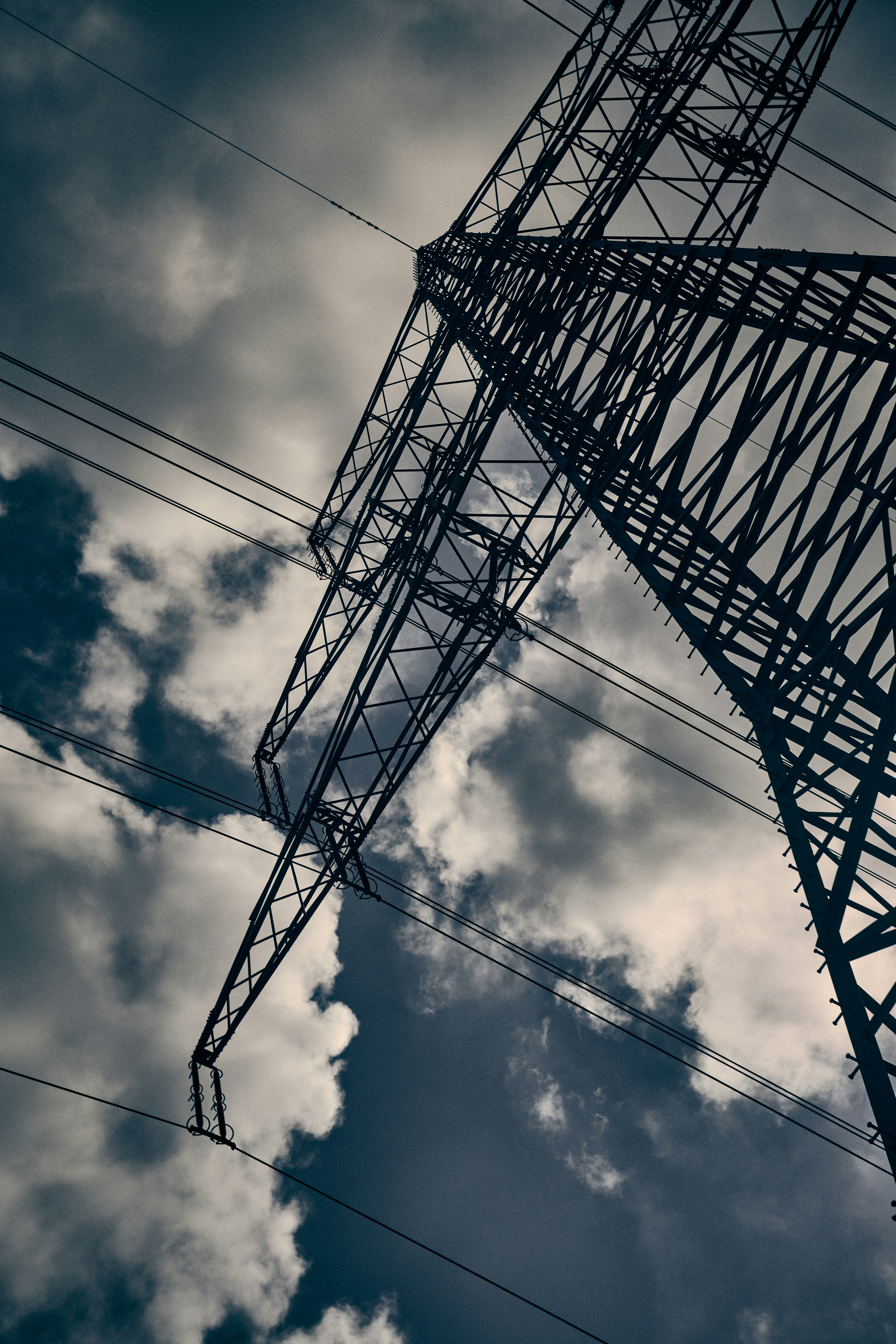 A high voltage power line against a cloudy sky photo – Free Power lines ...