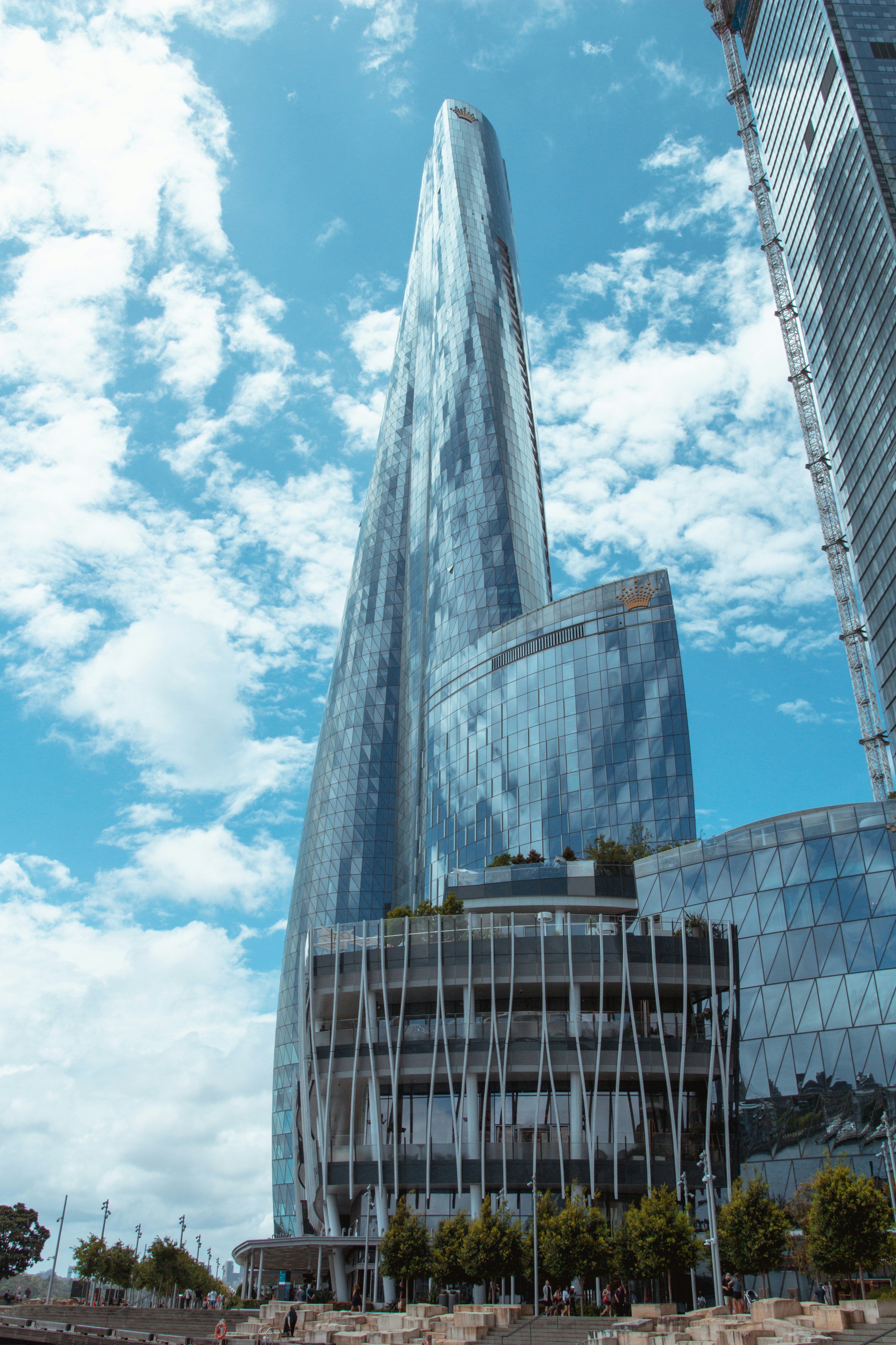 A very tall building sitting next to a very tall building photo – Free ...