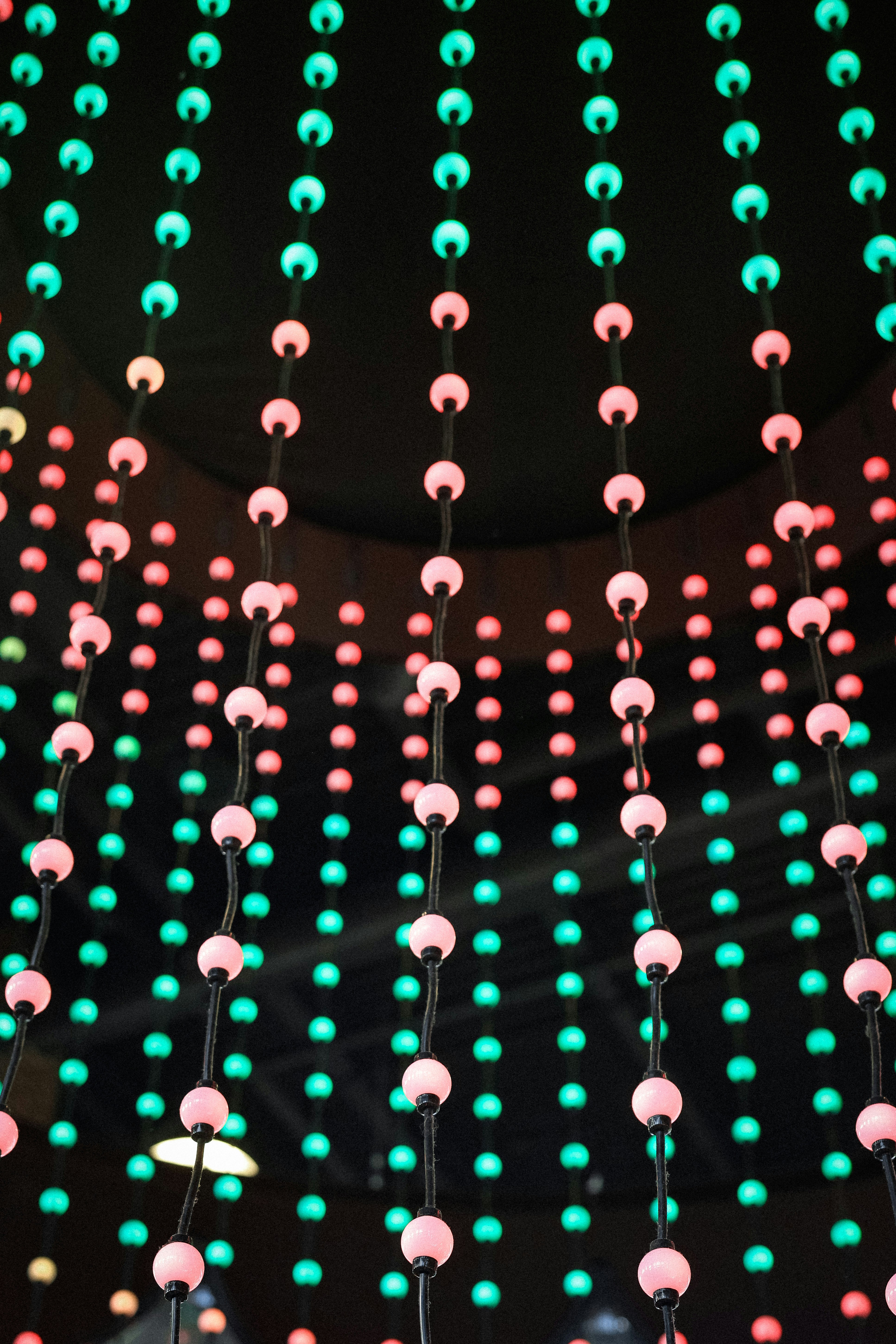 Neon Bead Curtain: A Cascade of Green and Pink Orbs