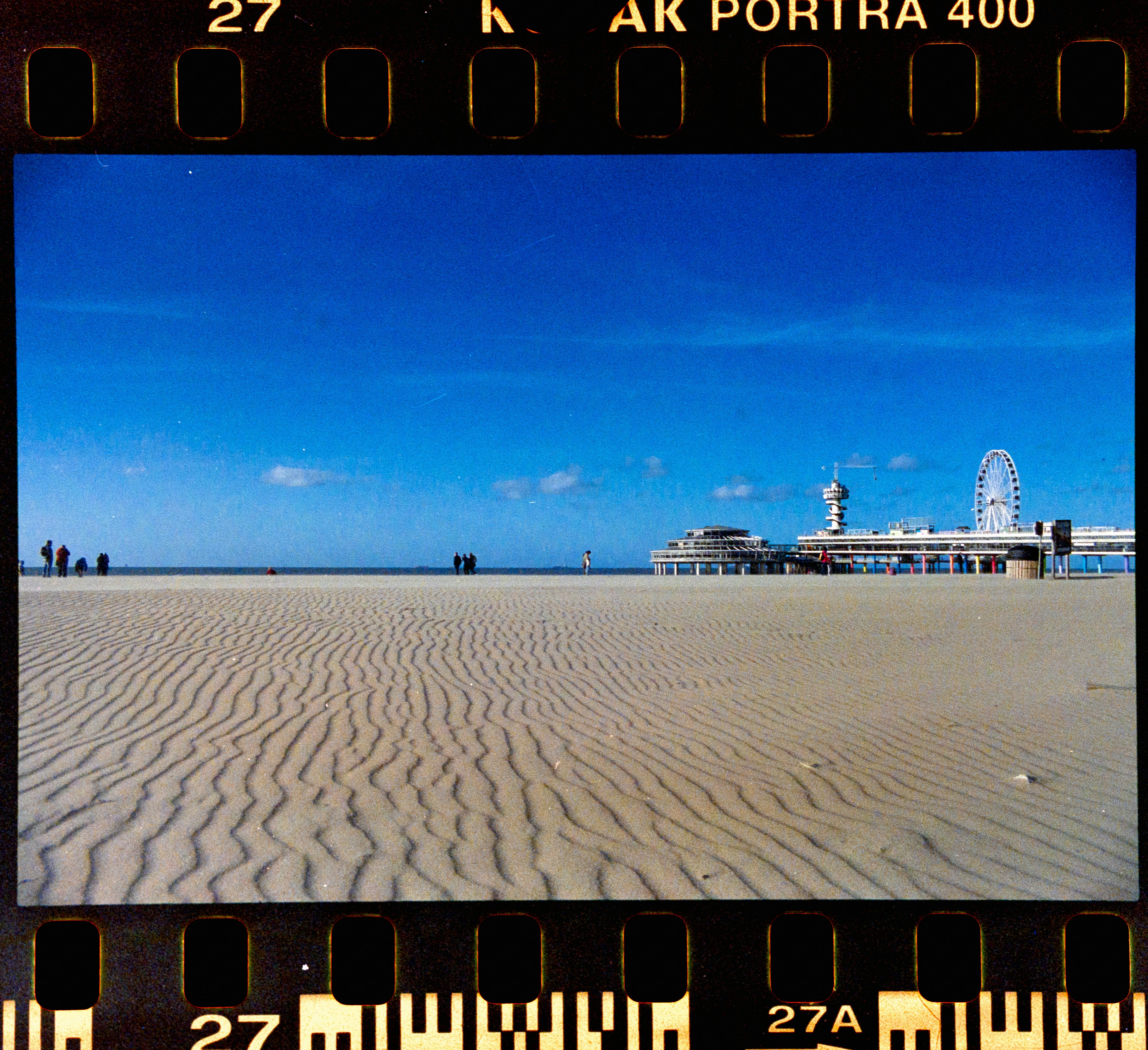 Deserted boardwalk horizon with distant ferris wheel