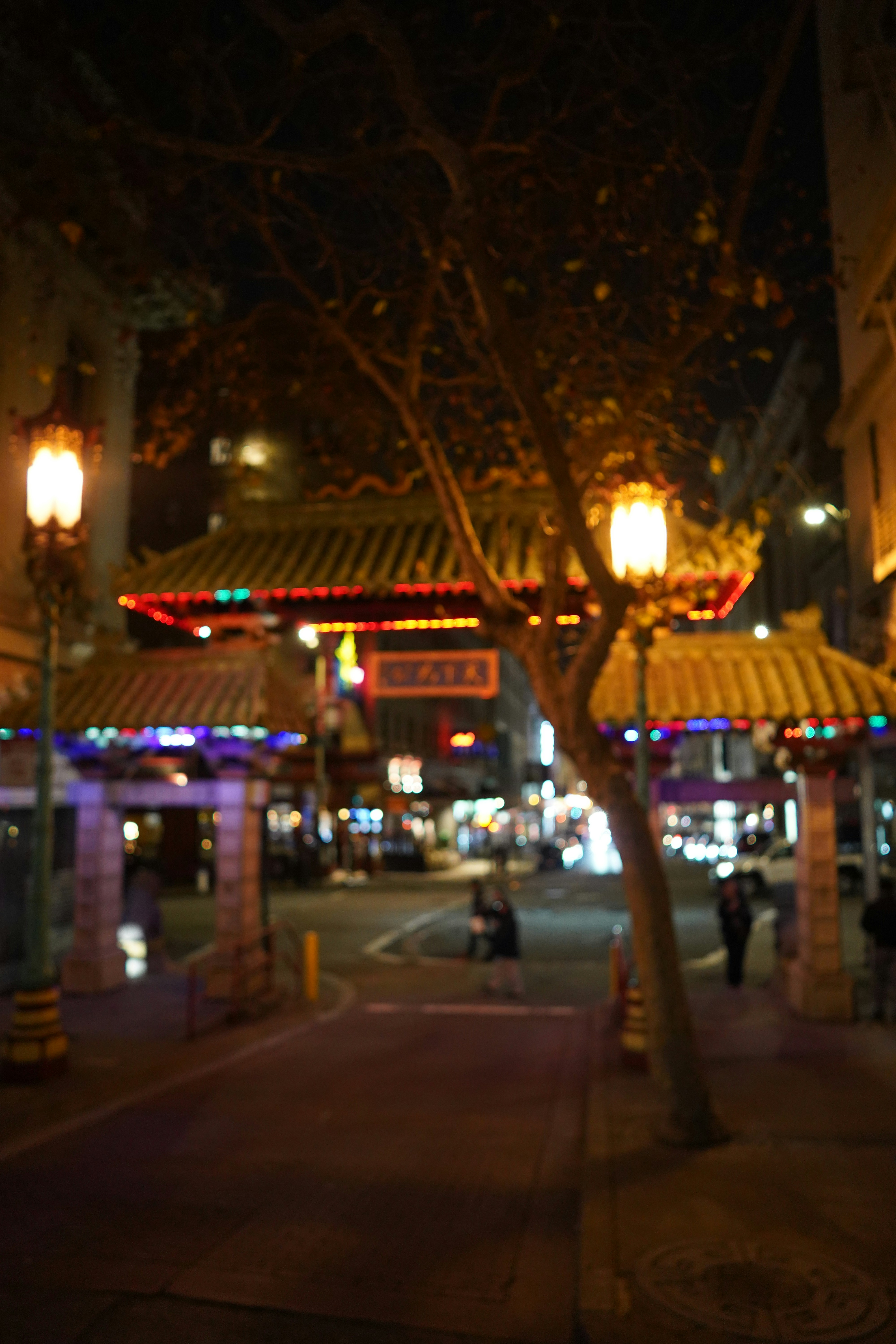 Neon Gate at Night: A Quiet Street Wrapped in Colorful Light