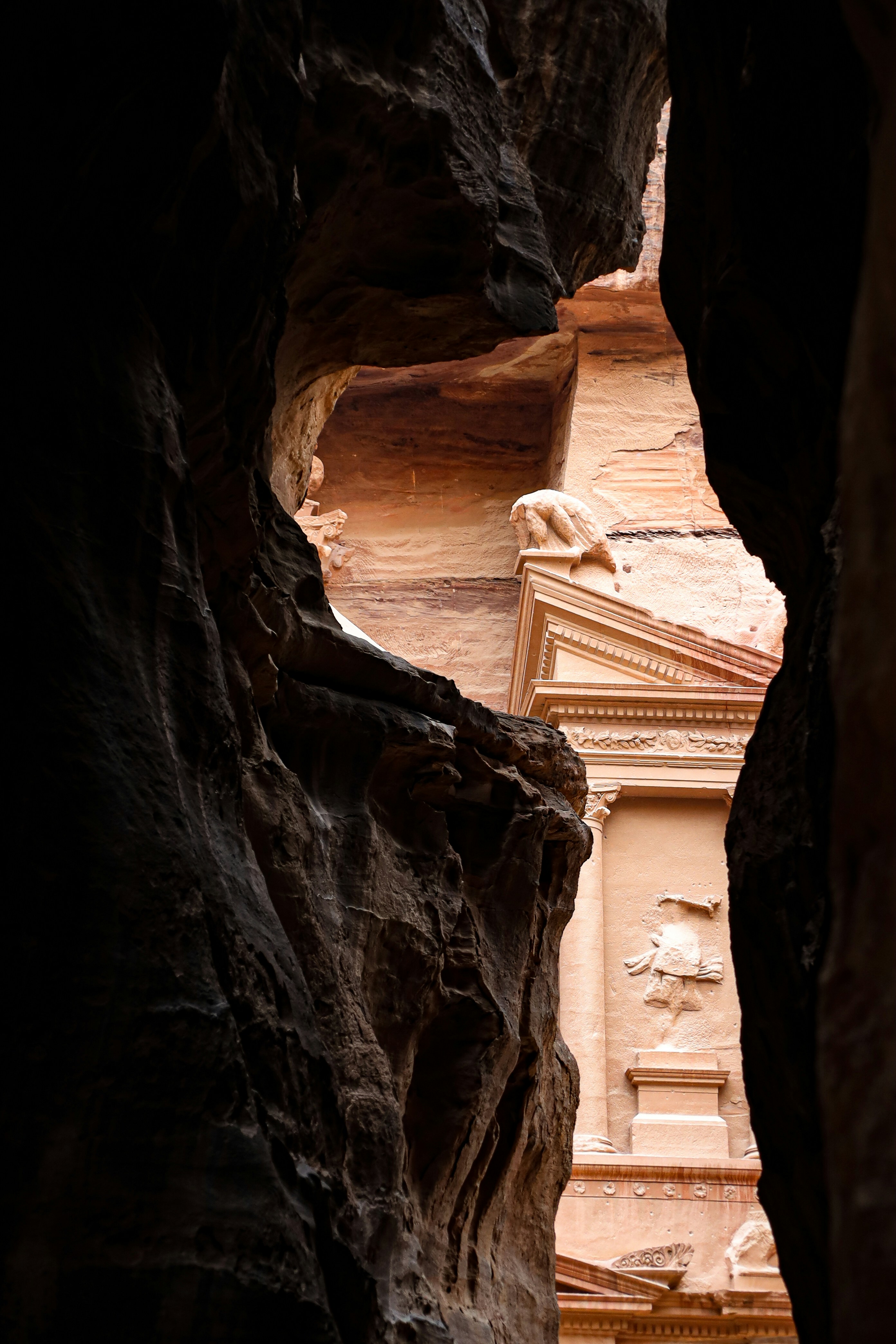 Through a Rock's Slit, a Carved Monument Emerges