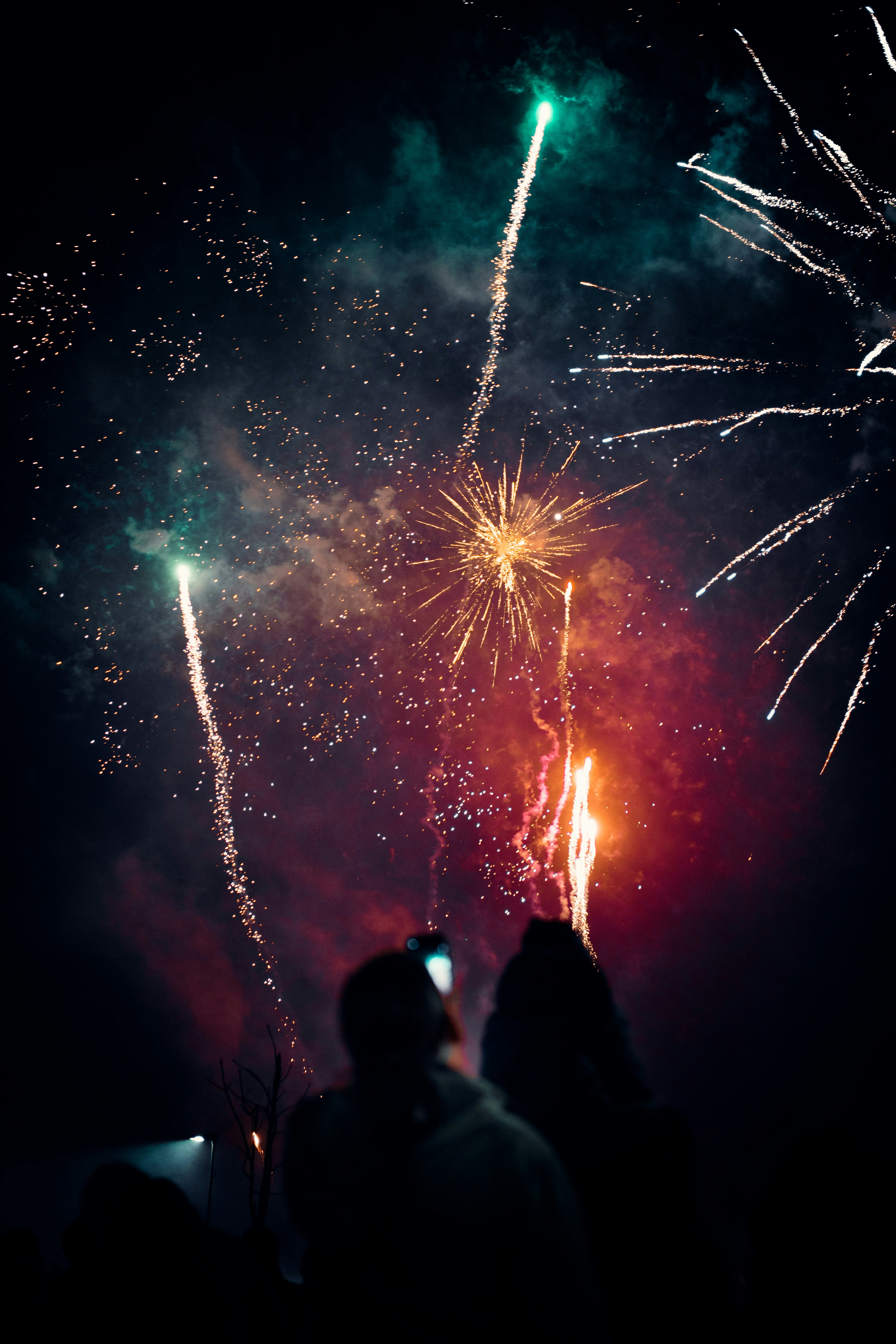 A group of people watching a fireworks display photo – Free Fireworks ...