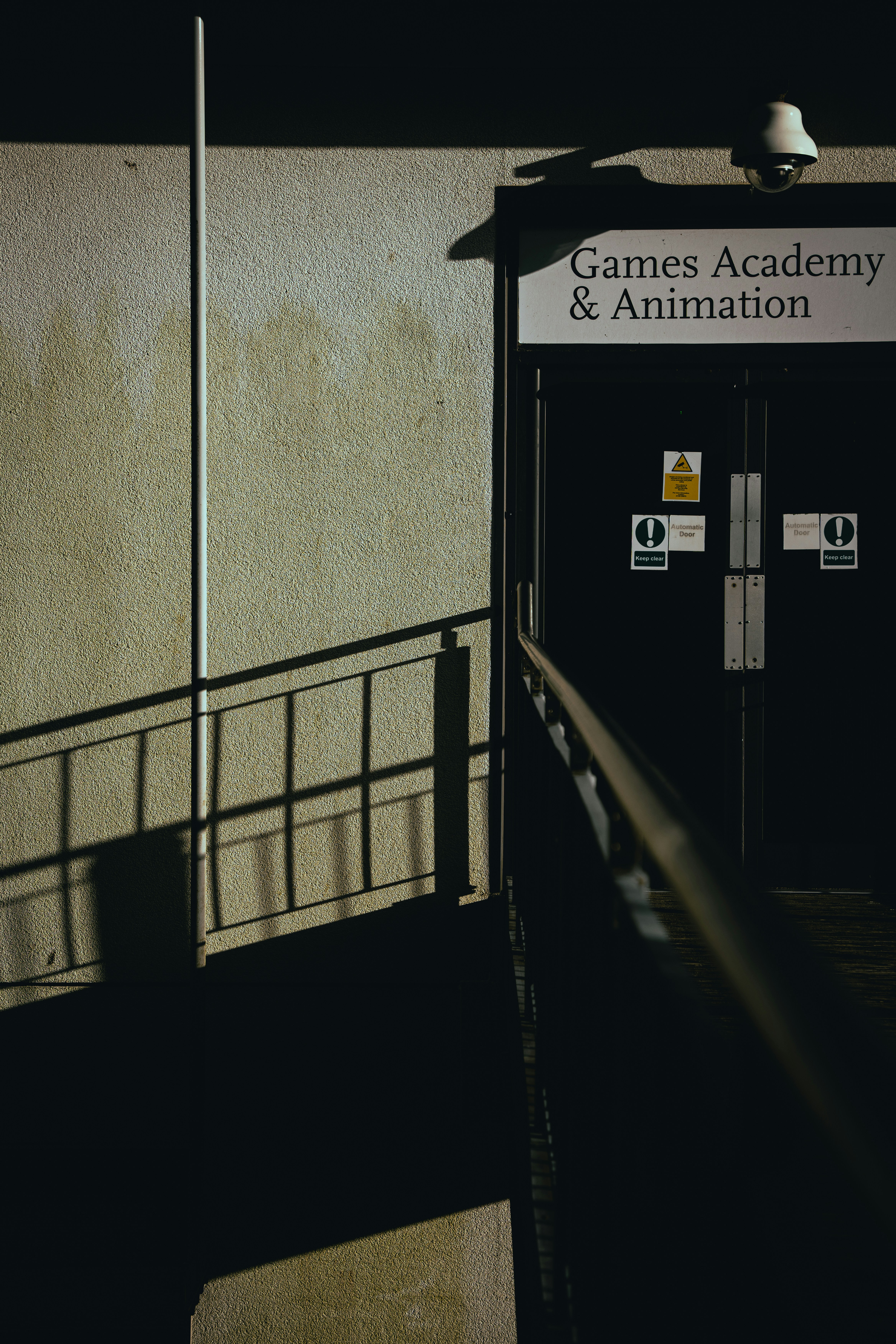 Entrance to Games Academy & Animation: Sunlit Wall and Shadowed Doorway