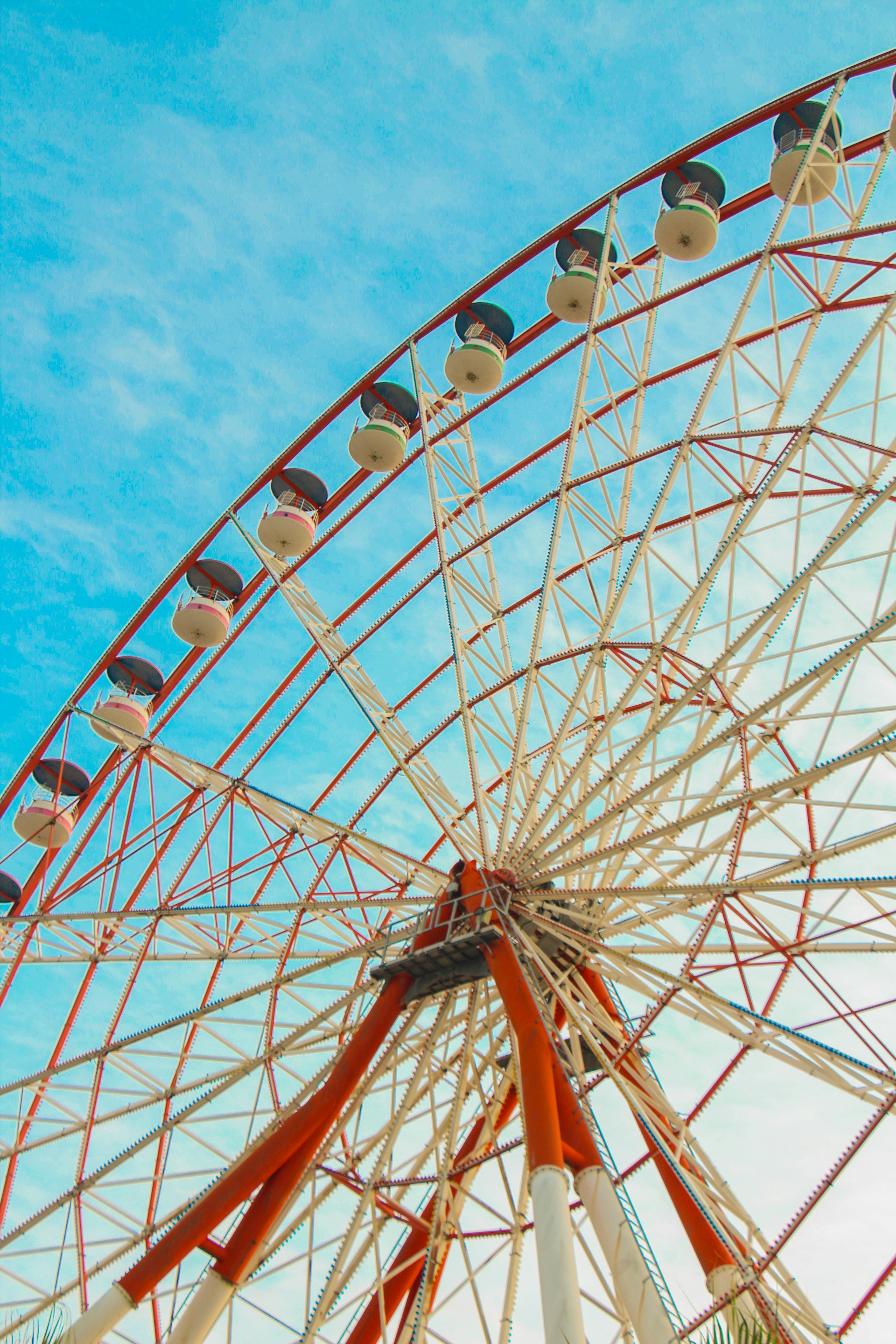 A large ferris wheel sitting under a blue sky photo – Free Georgia ...