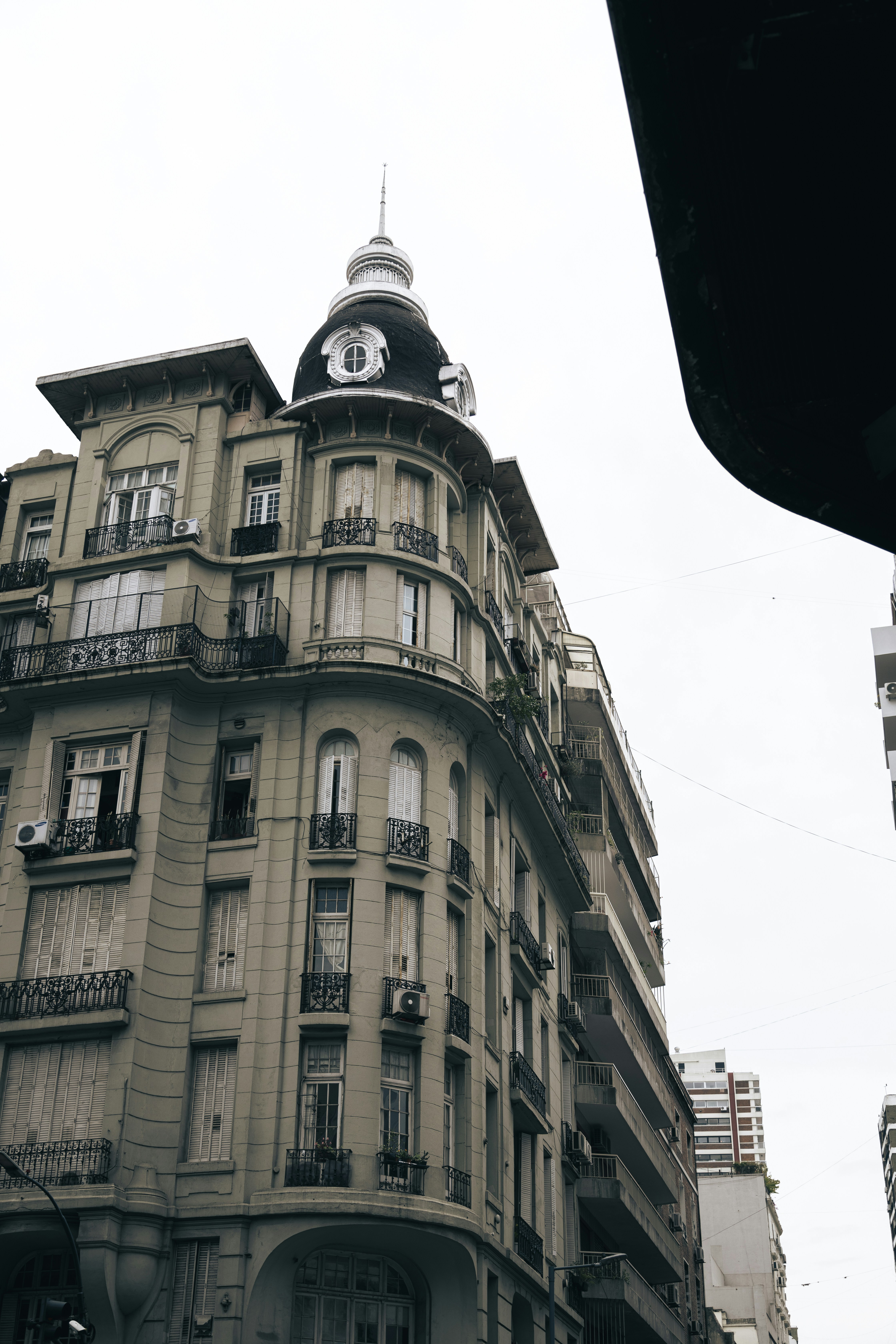 Corner Turret in the Overcast: Haussmannian Facade Reaching Skyward