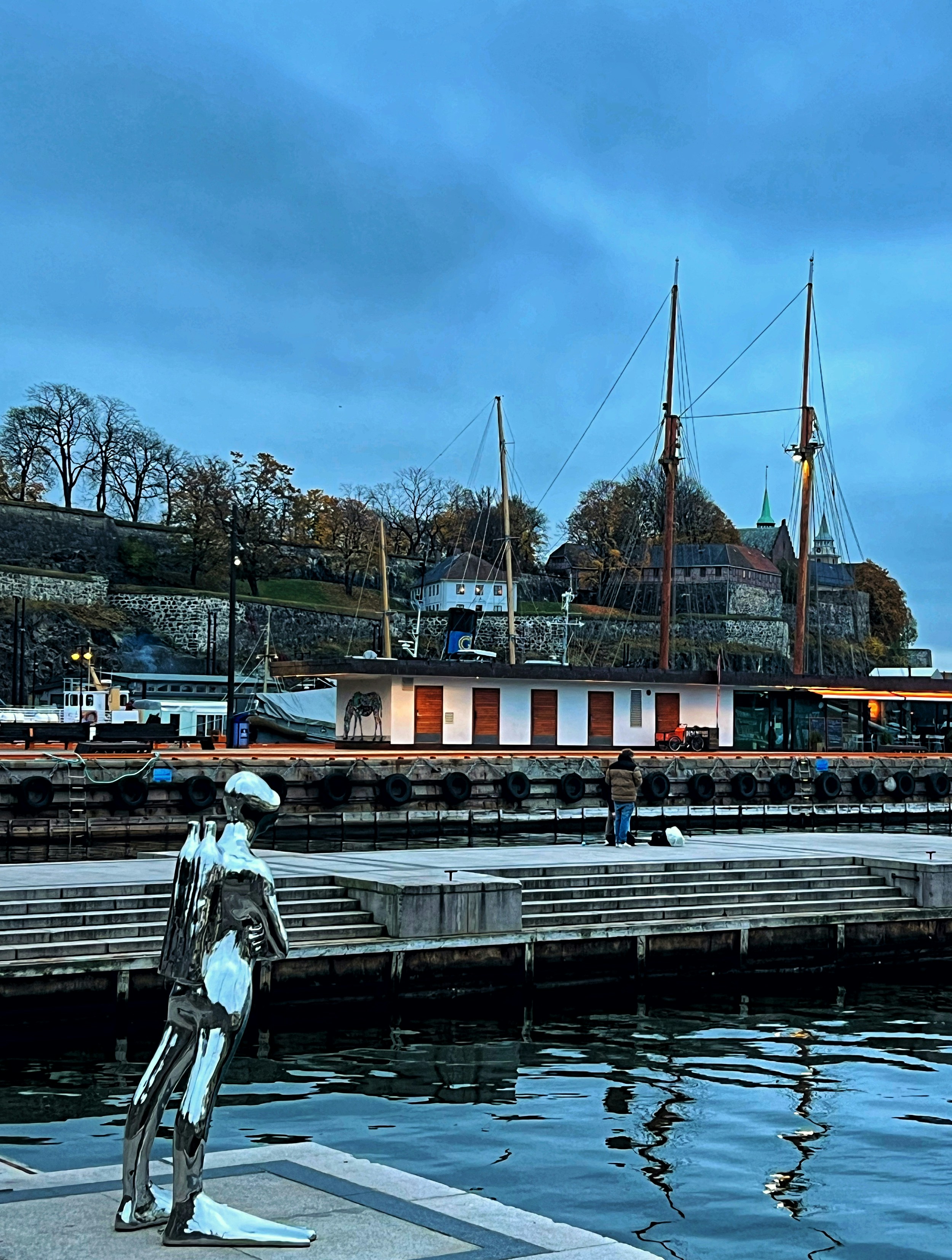 Harbor Sentinel: A Polished Figure at the Dockside