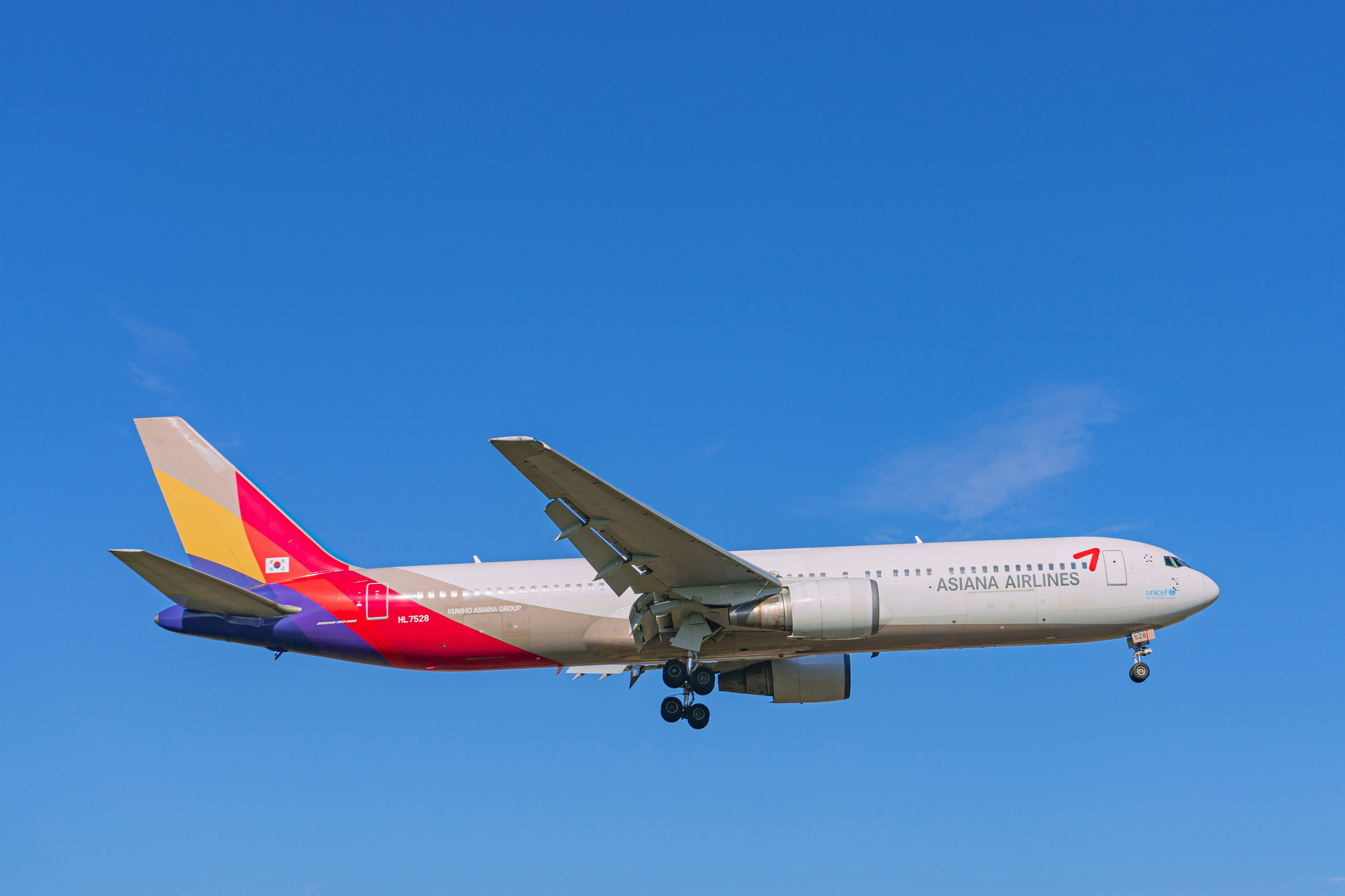 Sapphire Sky Descent: Asiana Airlines Widebody in Clear Blue