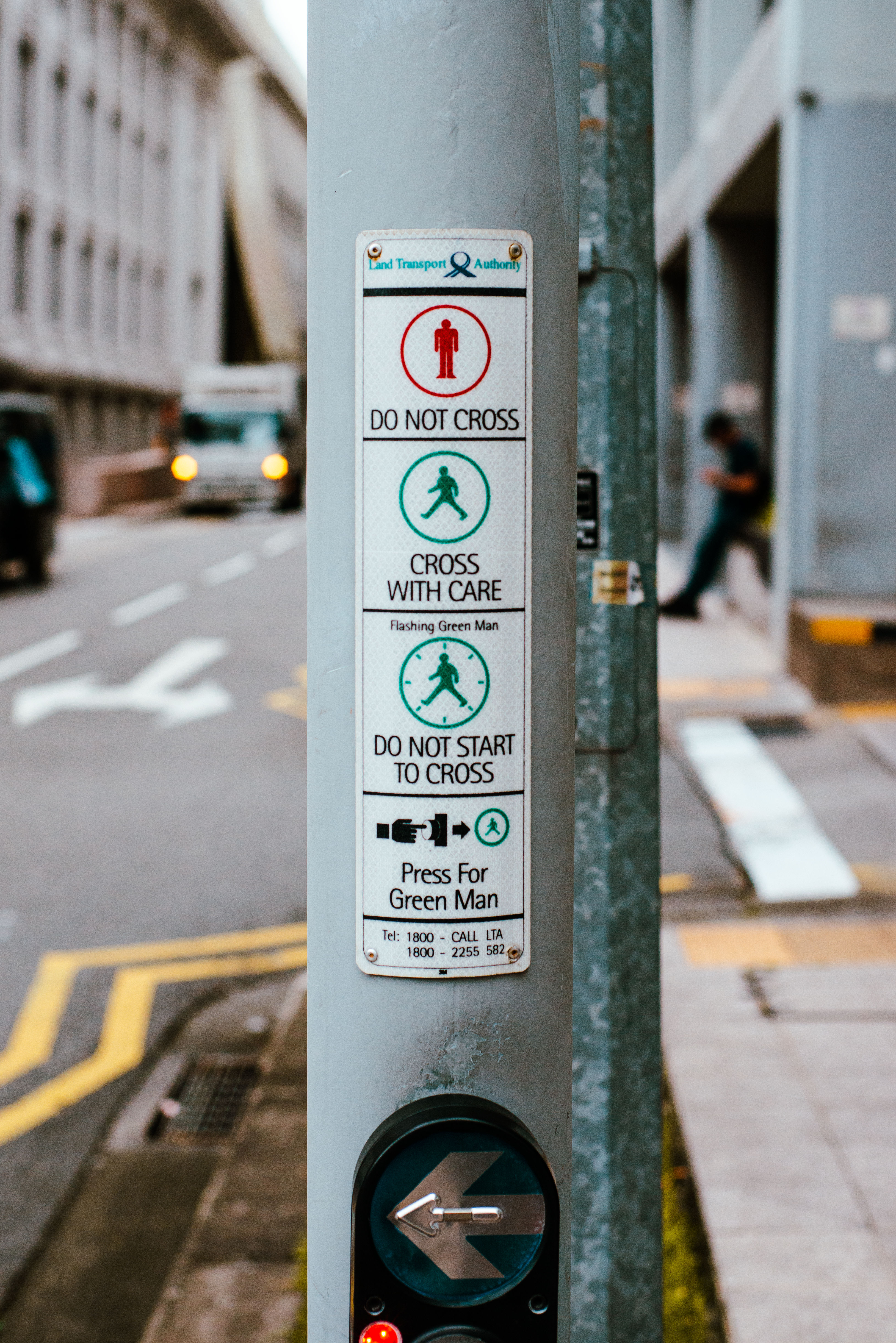 A pole with some signs on it on the side of the road photo – Free ...