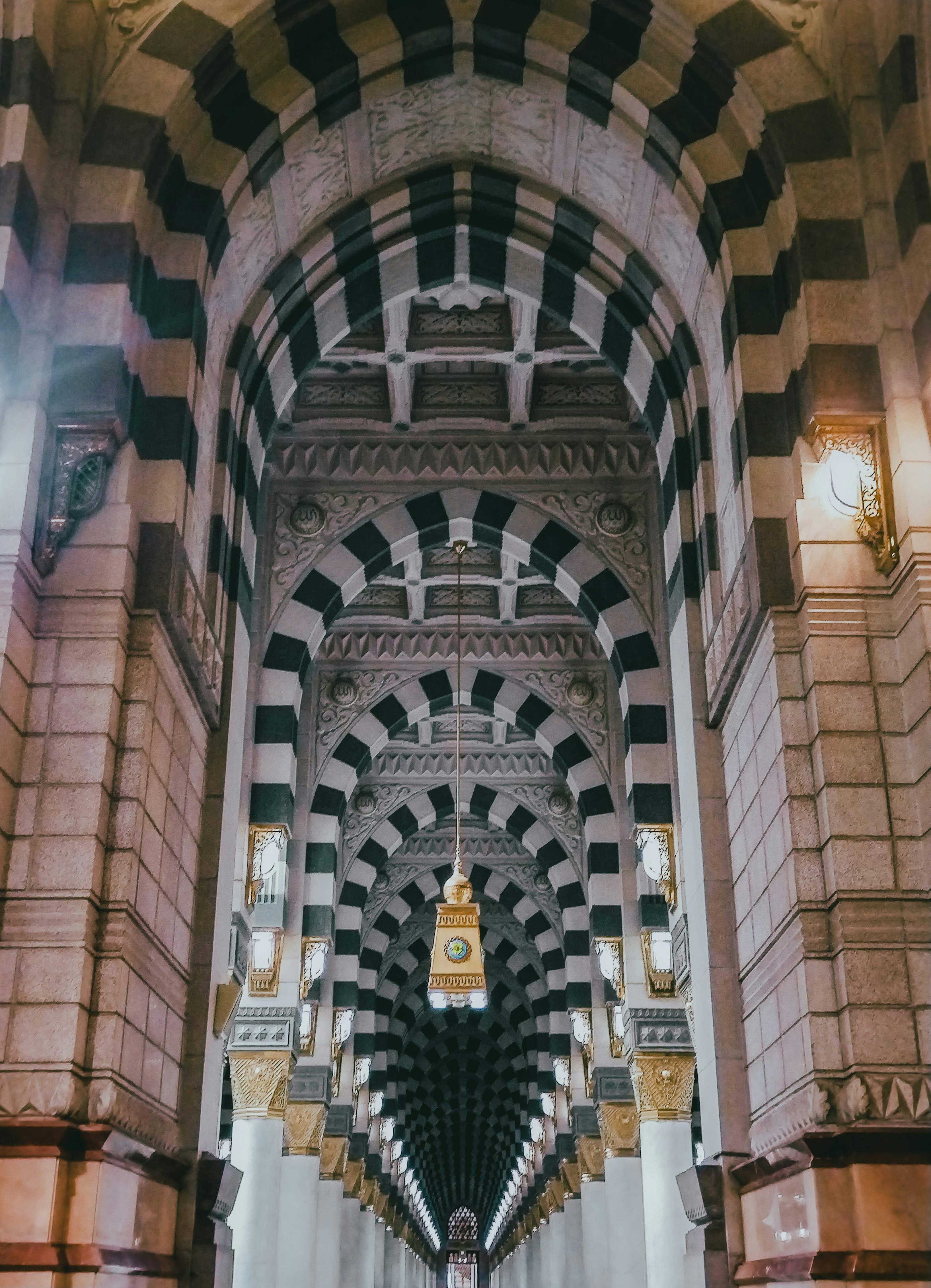 A large building with a clock on the wall photo – Free Masjid an-nabawi ...