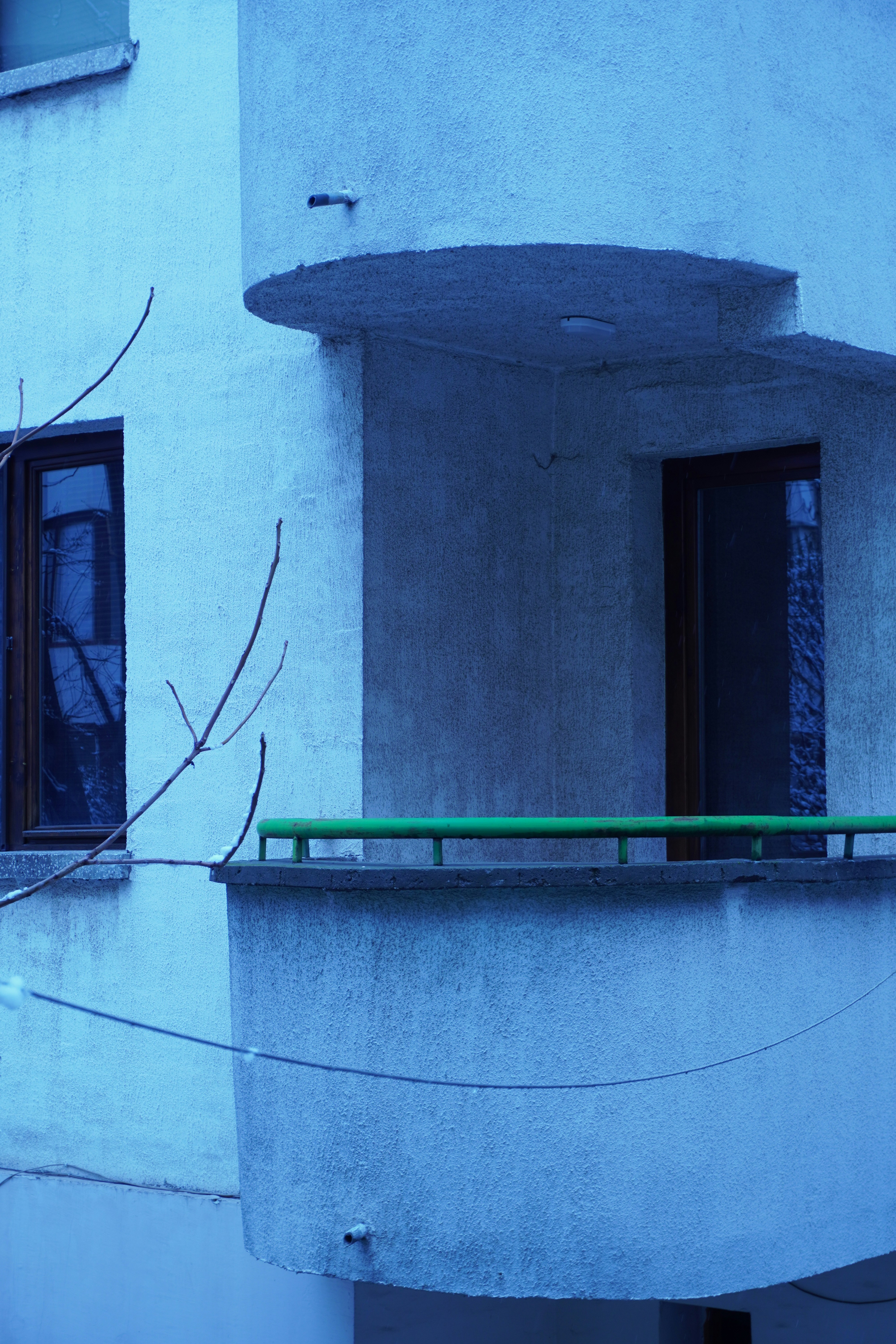 Azure Balcony: Concrete Geometry Under Cool Light