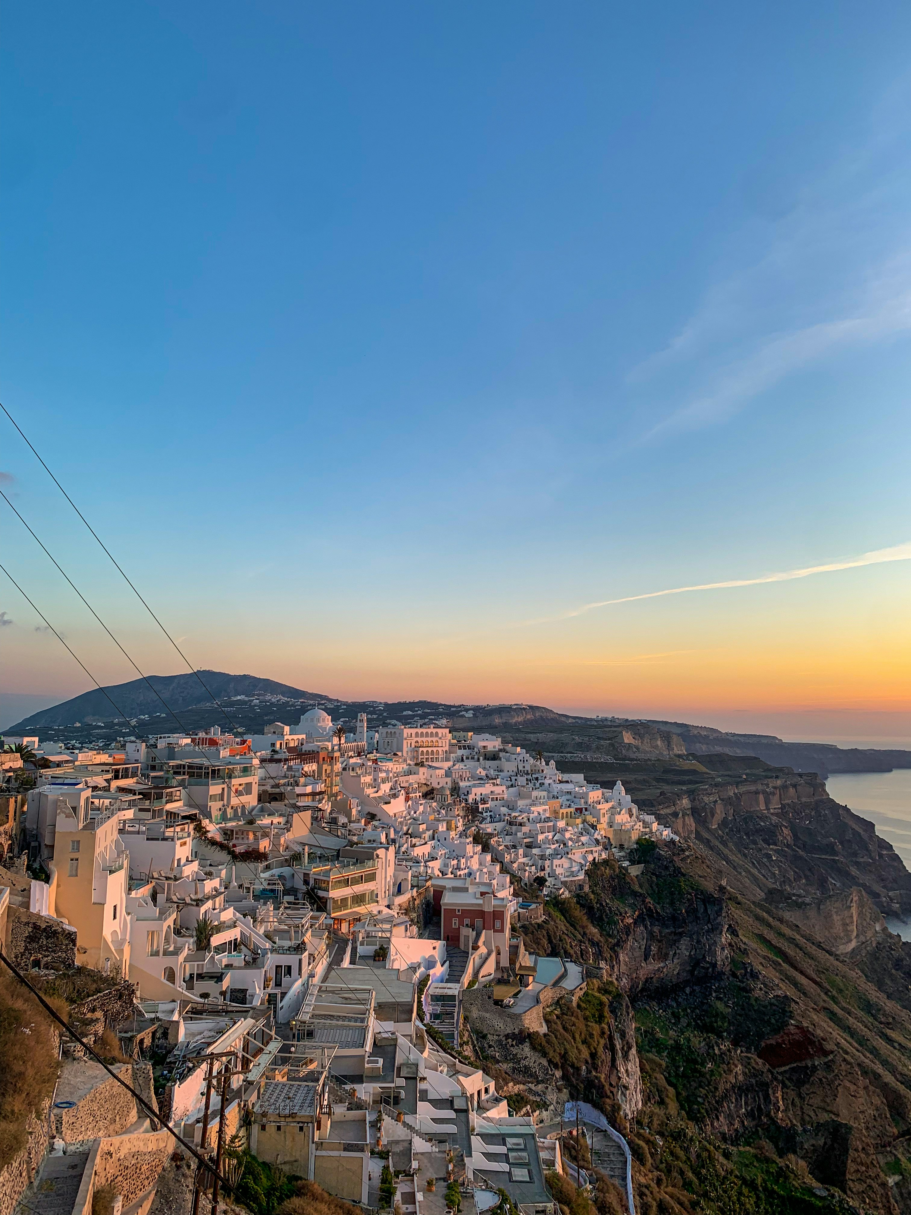 Terraced Whitewashed Santorini at Sunset: A Cliffside Quilt of Light