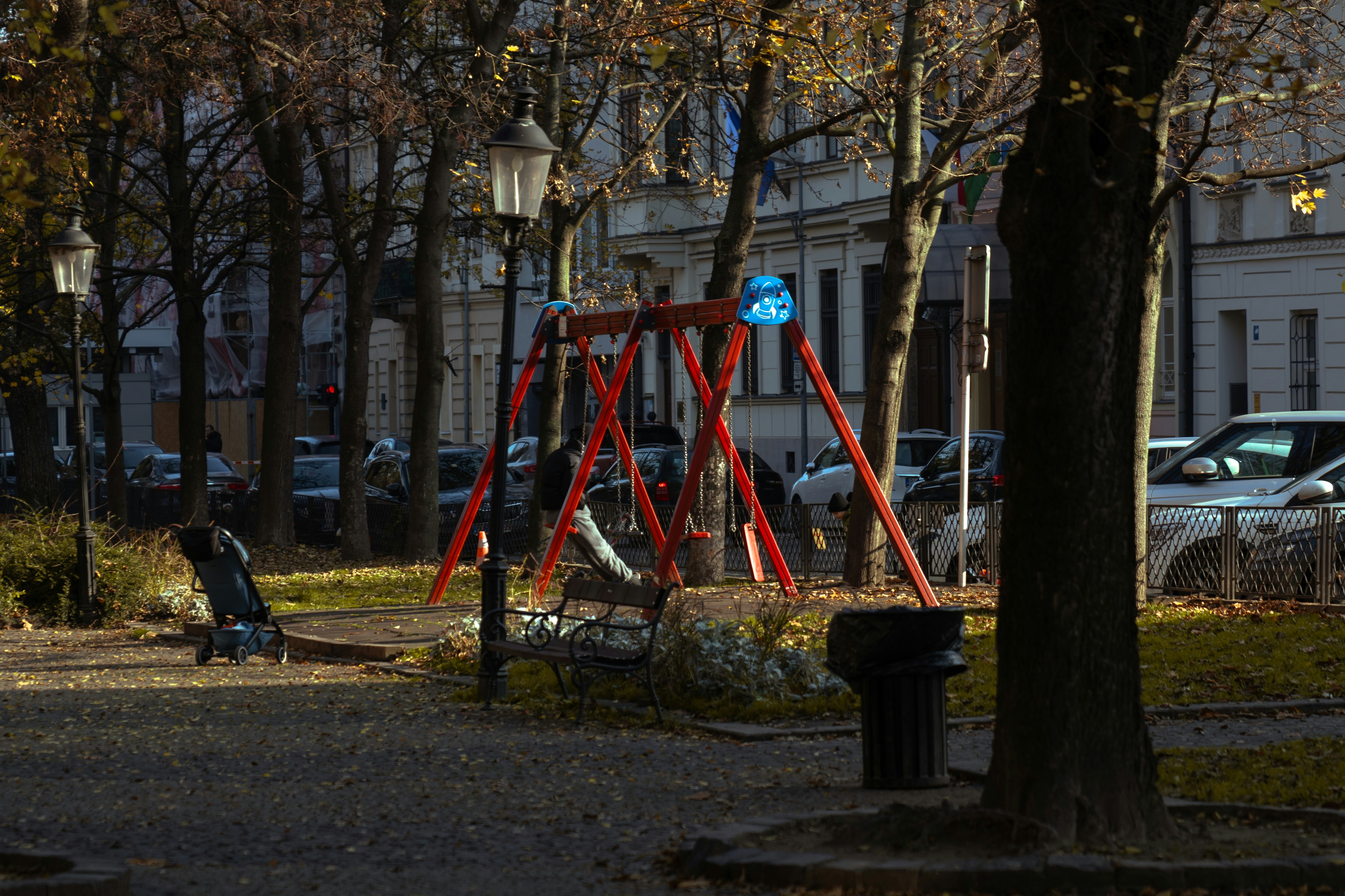 A red swing set in the middle of a park photo – Free Bratislava Image ...