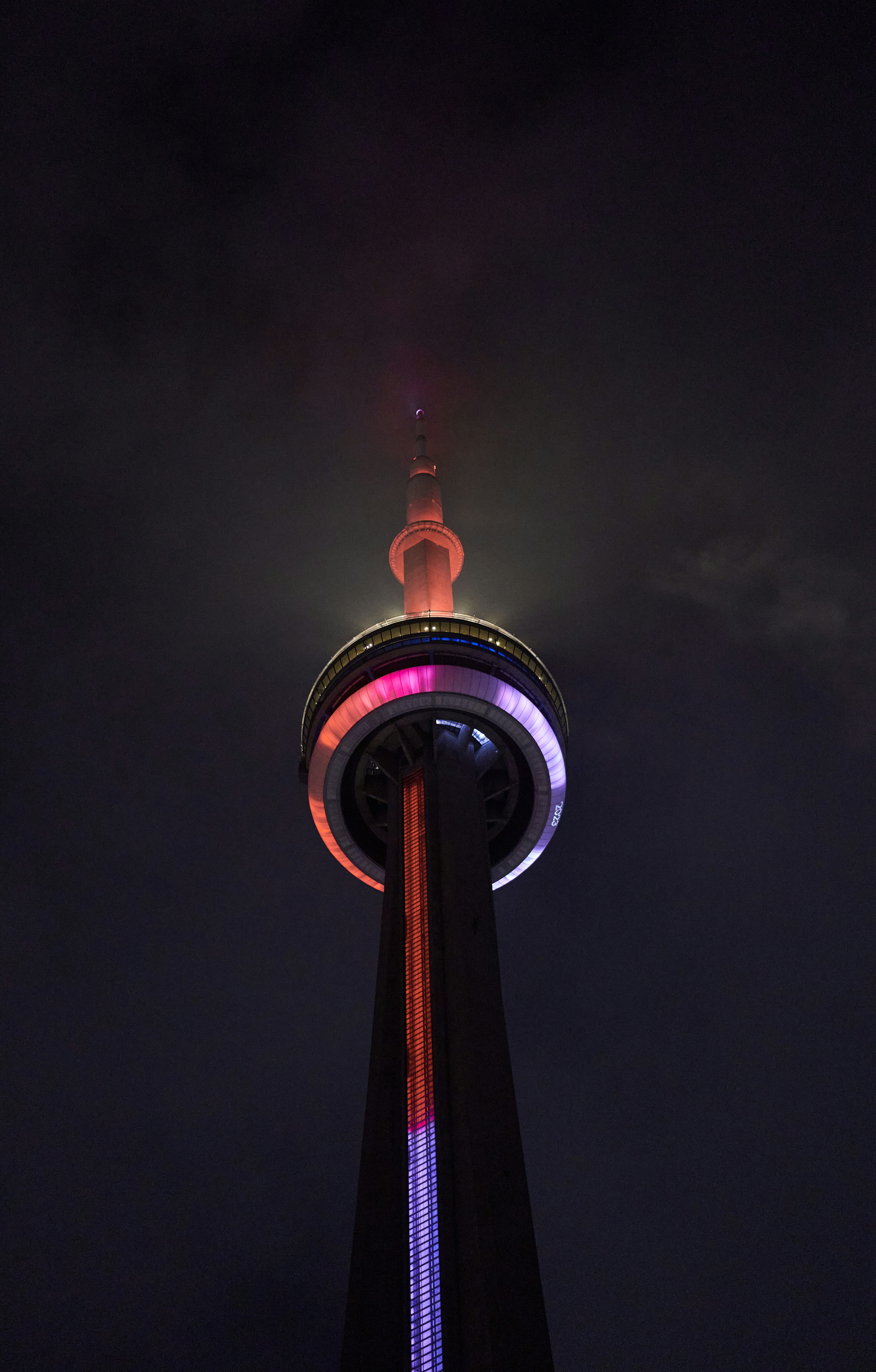 A very tall tower with a very bright light on it's side photo – Free ...