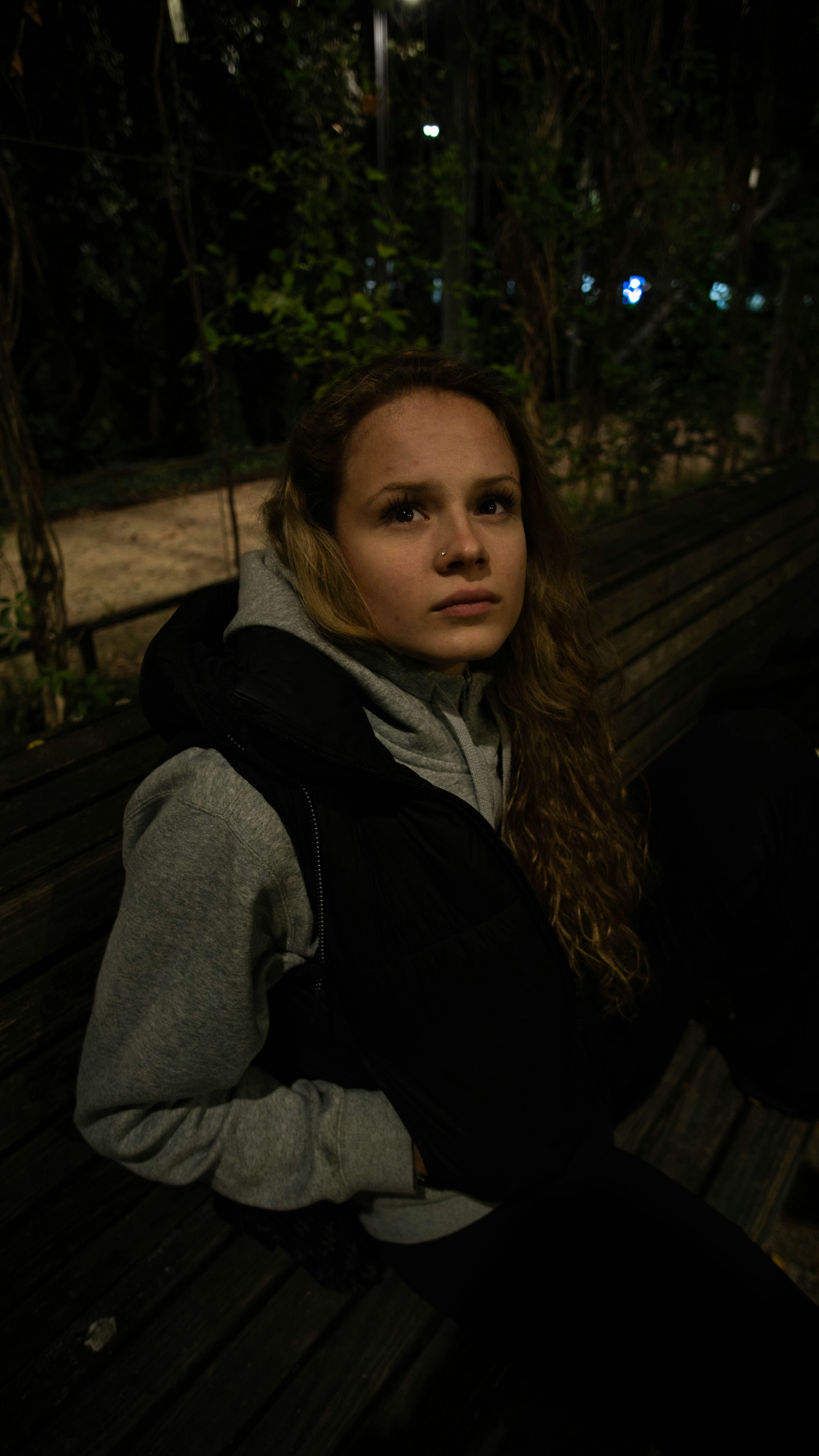 Nighttime Portrait on a Wooden Bench