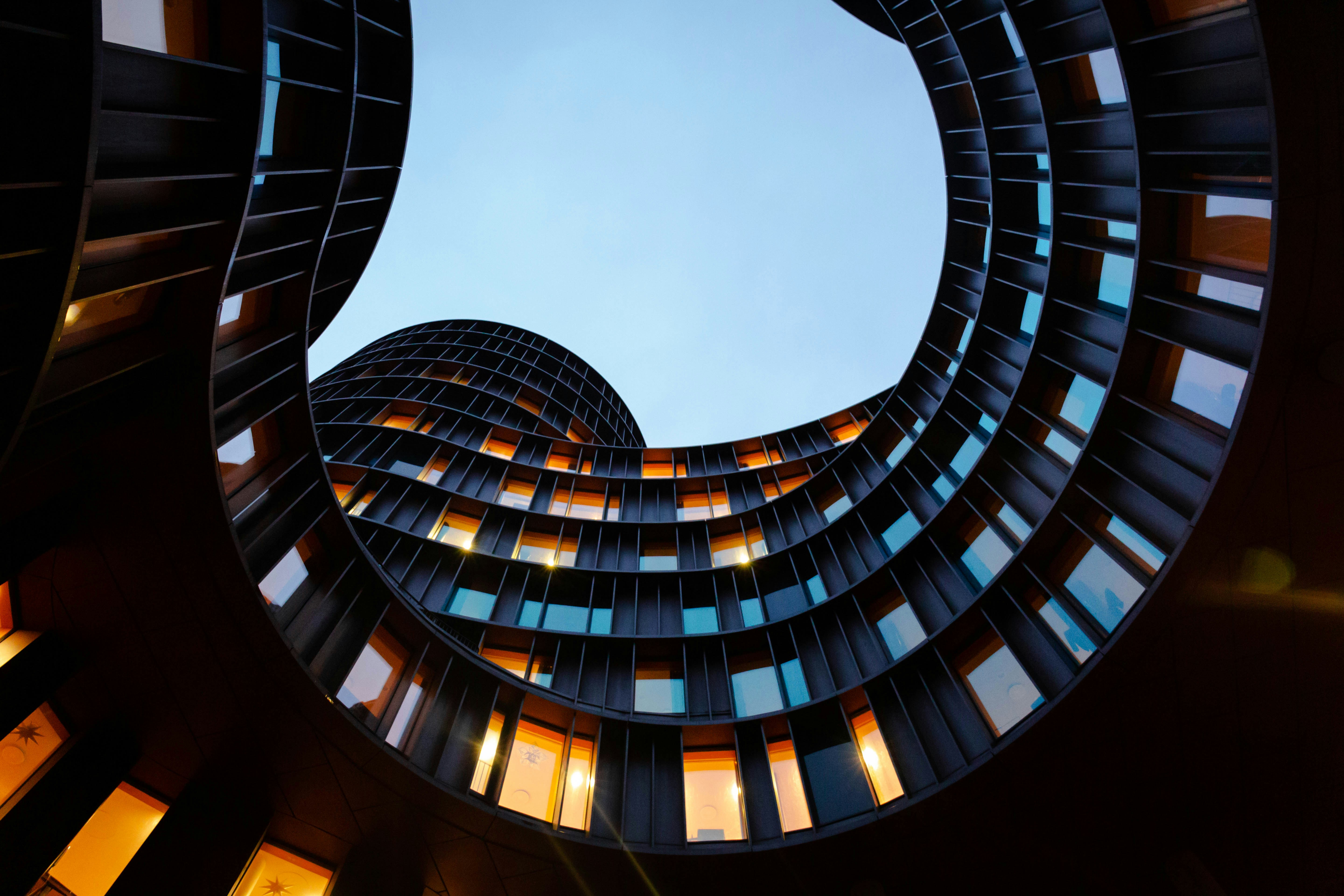 A very tall building with lots of windows photo – Free Axel towers ...