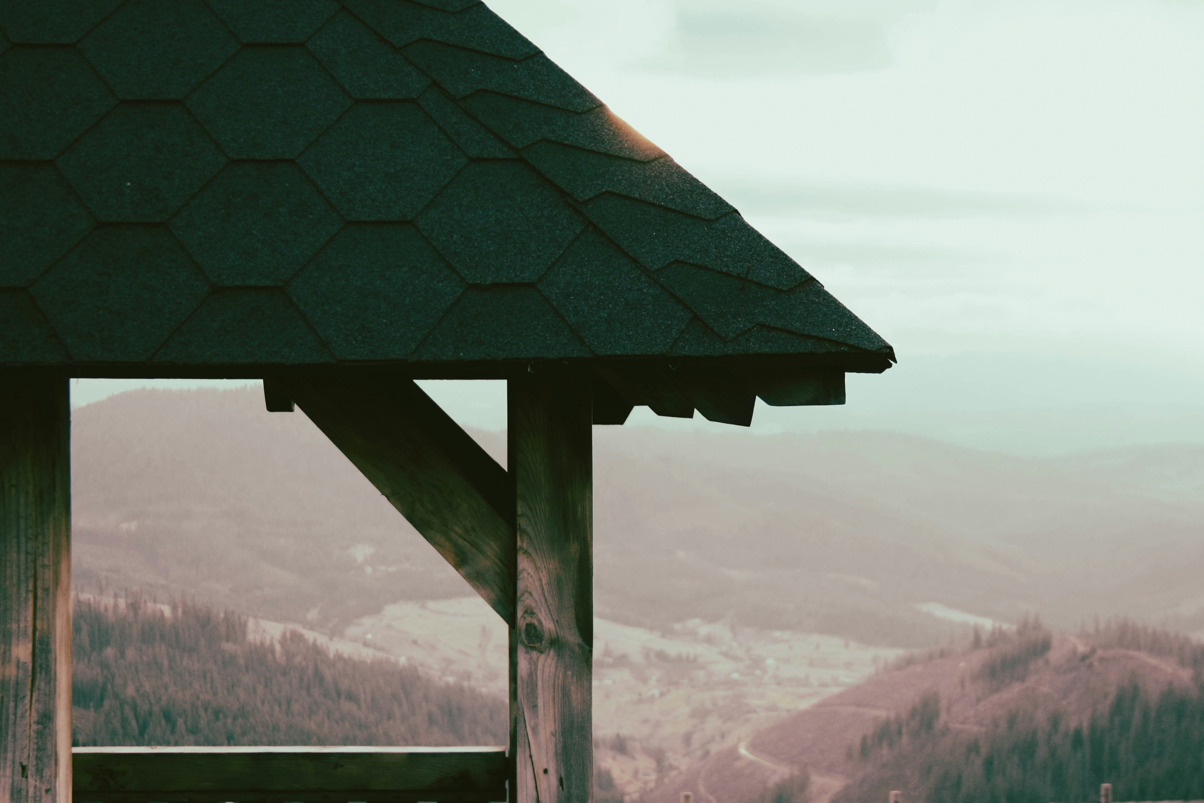 Edge of the Ridge: A wooden shelter overhanging a misty valley