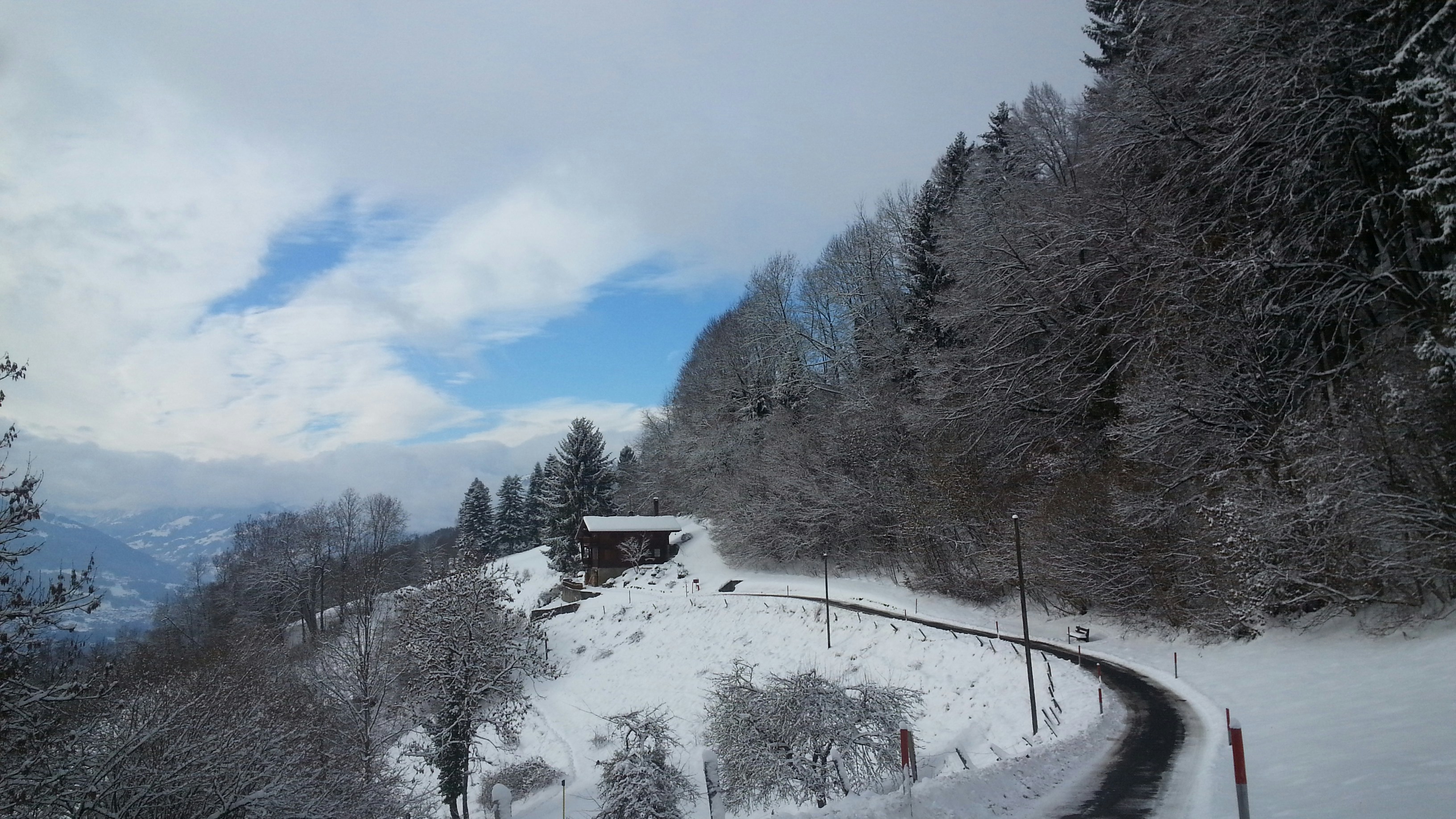 A snow covered hill with a house on top of it photo – Free Switzerland ...