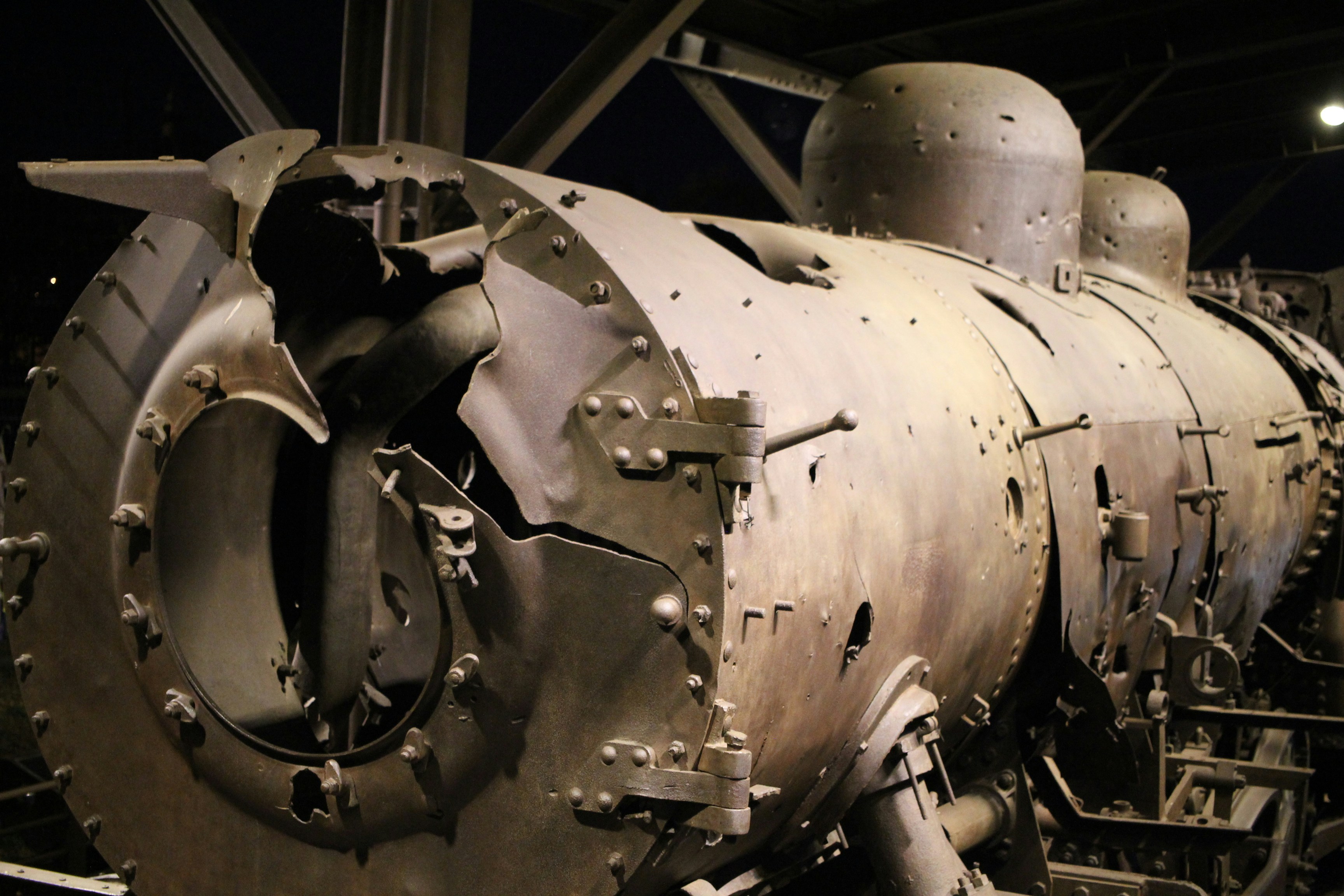 A close up of a large metal object on display photo – Free Night Image ...