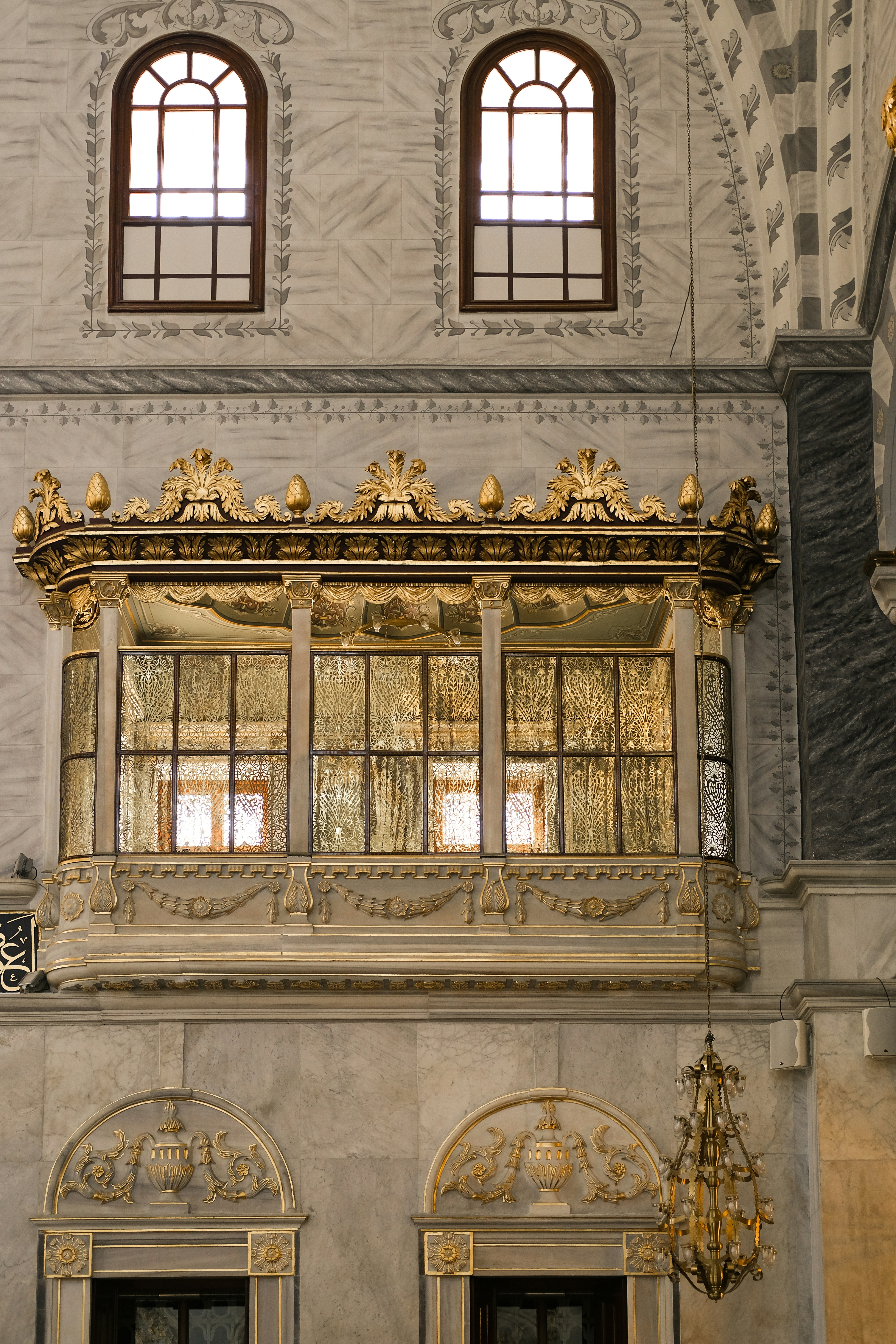 a large building with two windows and a clock