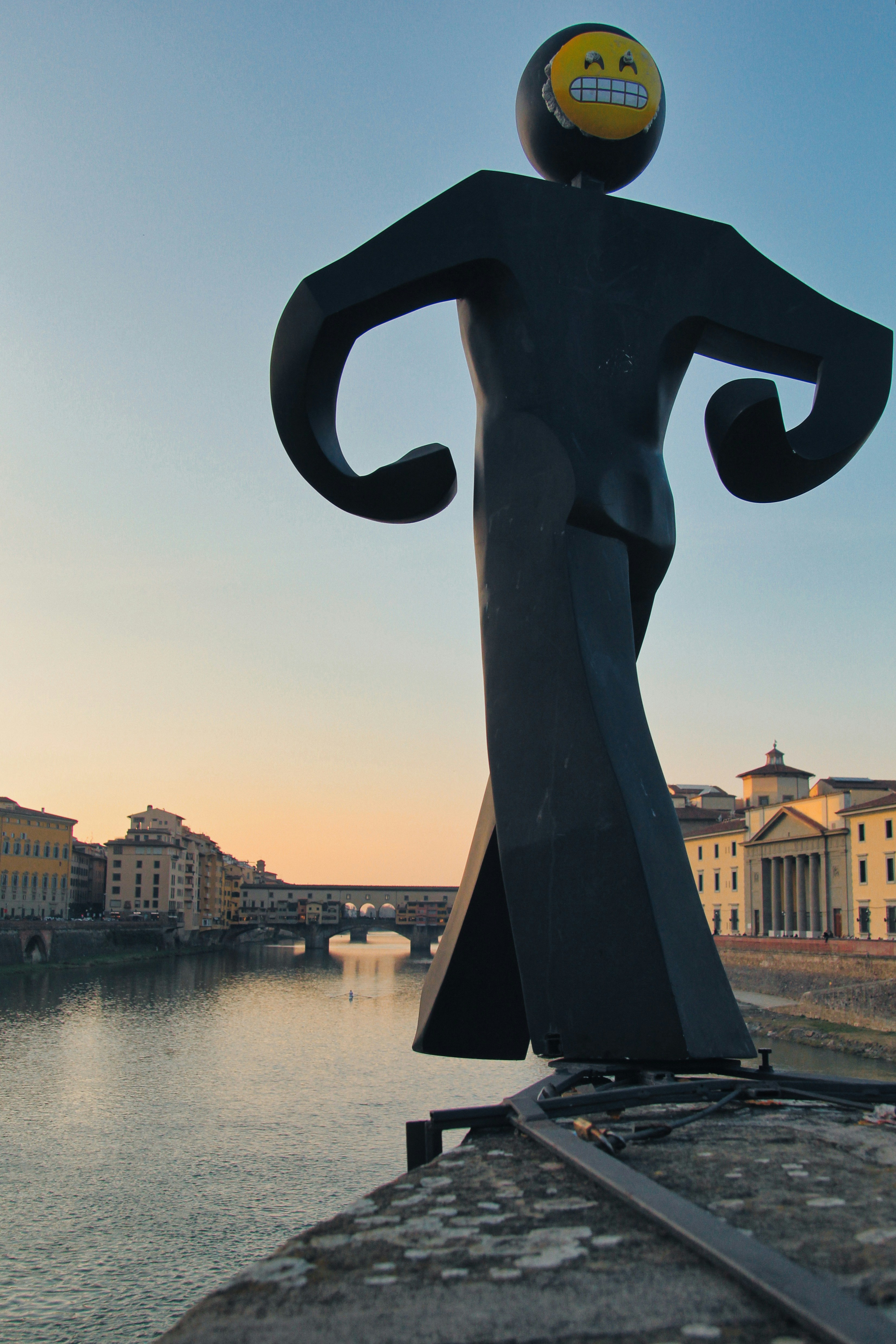 Yellow-Headed Colossus Over the Arno at Dusk