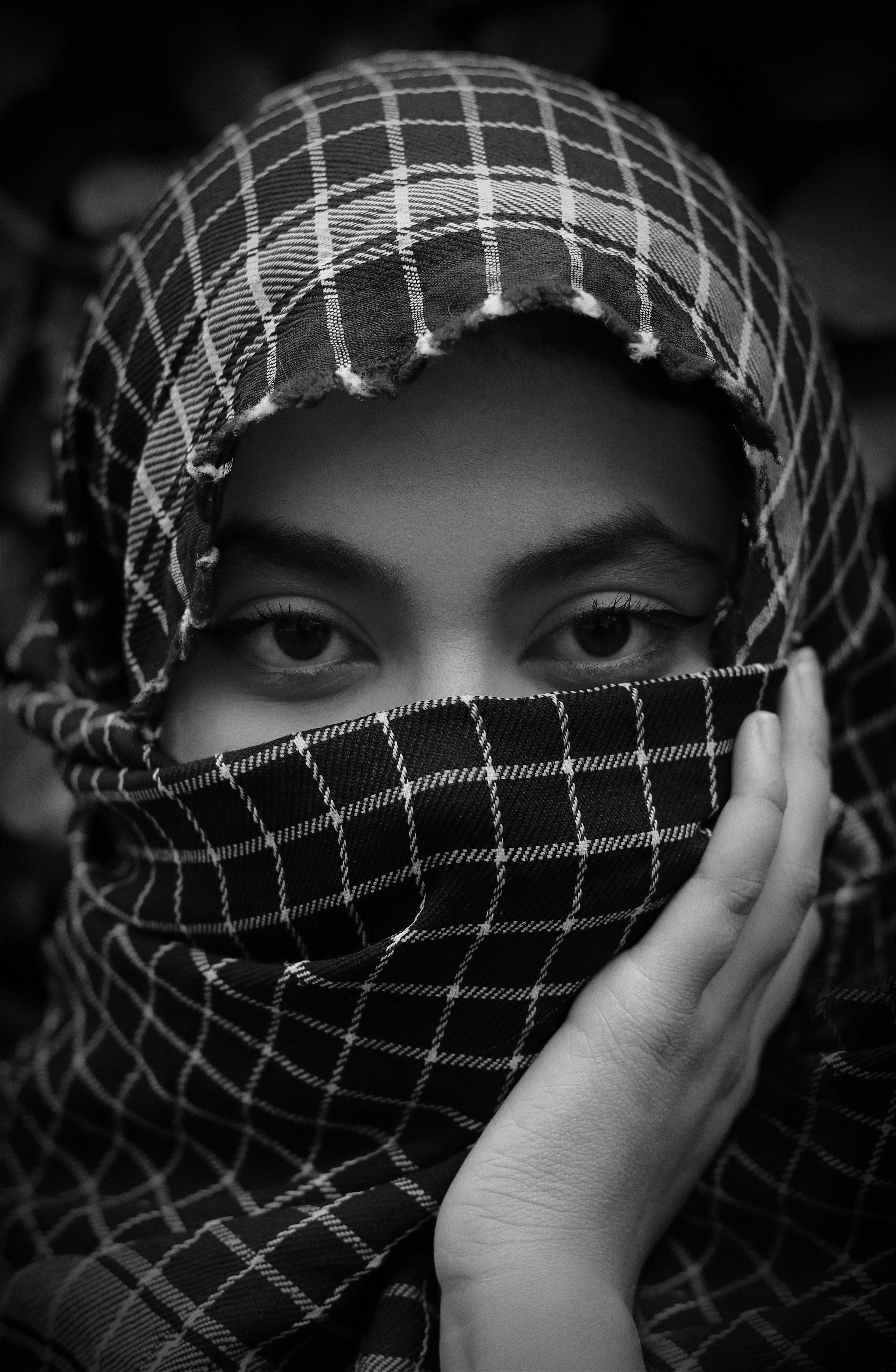 A woman wearing a scarf covering her face photo – Free Portrait Image ...