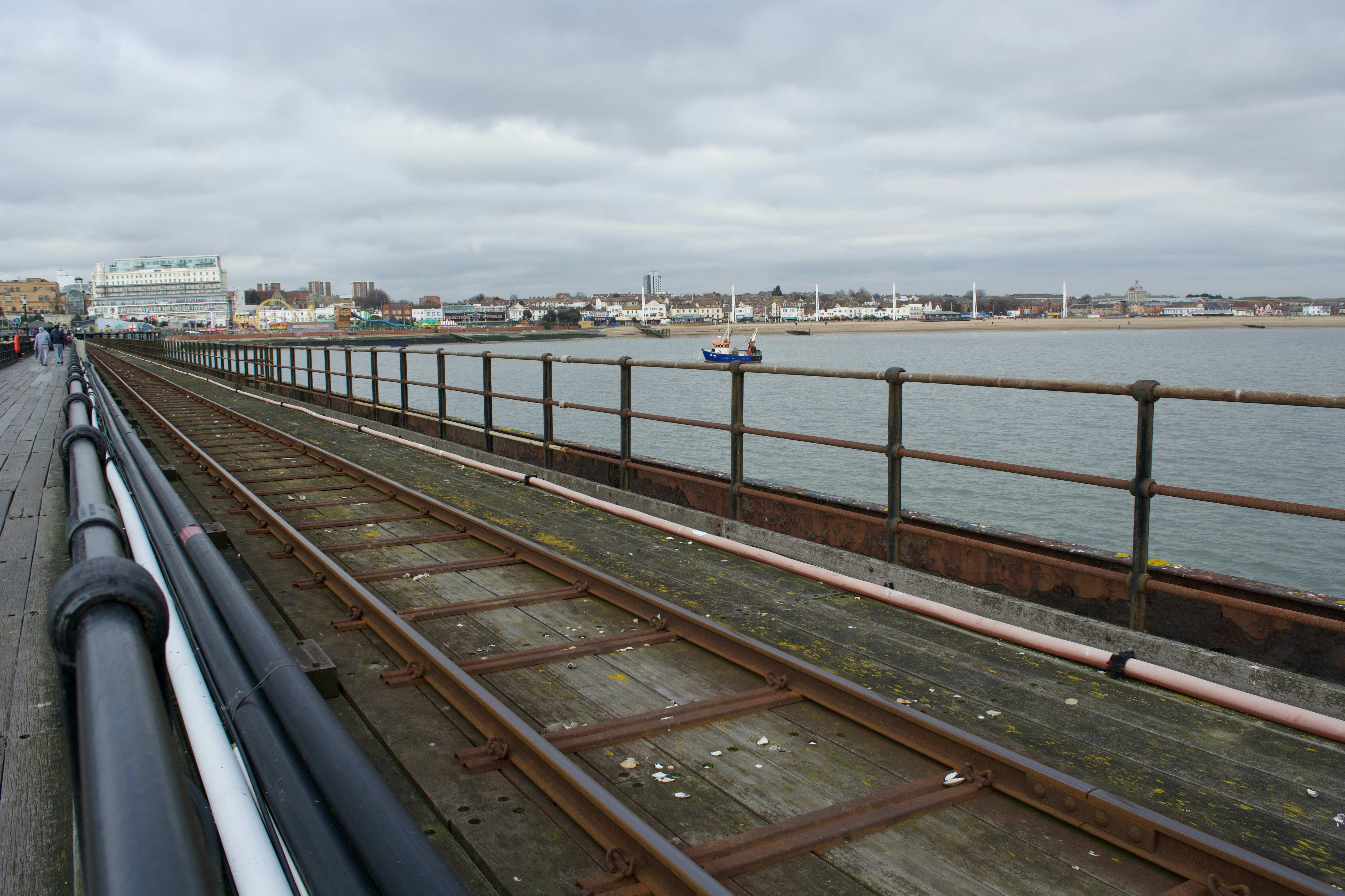 a train track next to a body of water
