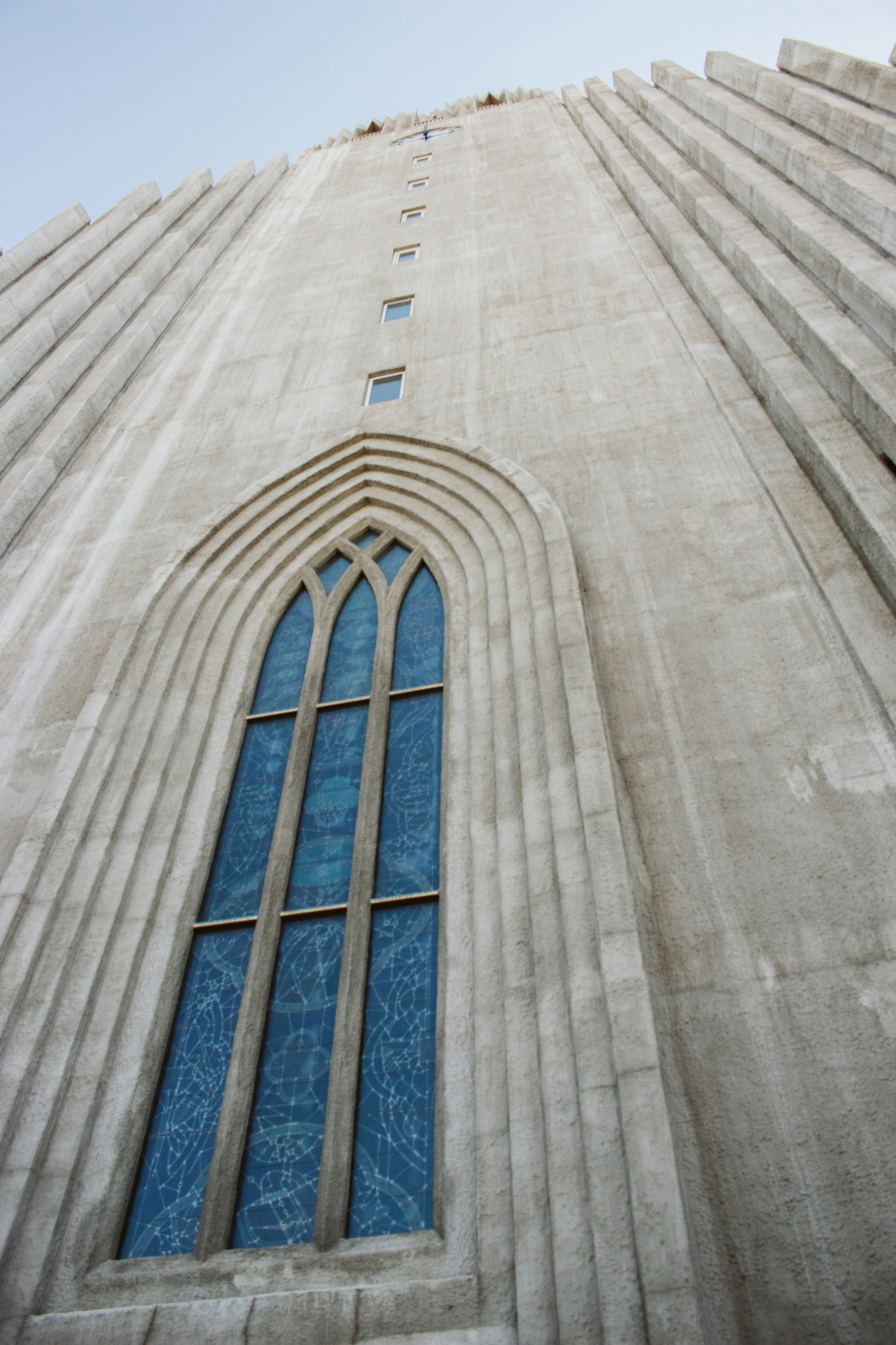 a very tall building with a very big window