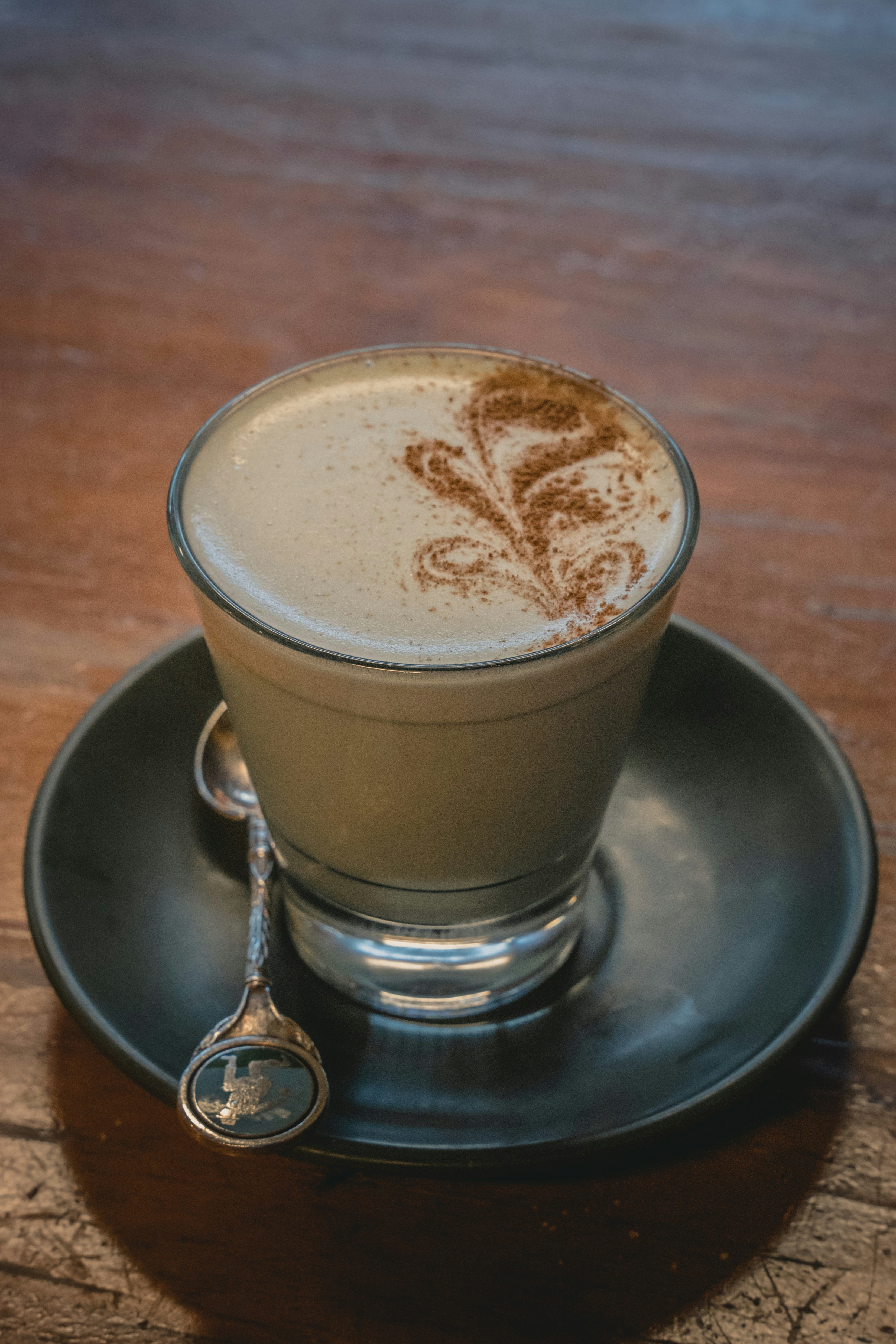 Caffeinated Symmetry: A Glass of Espresso with Lacy Foam Art