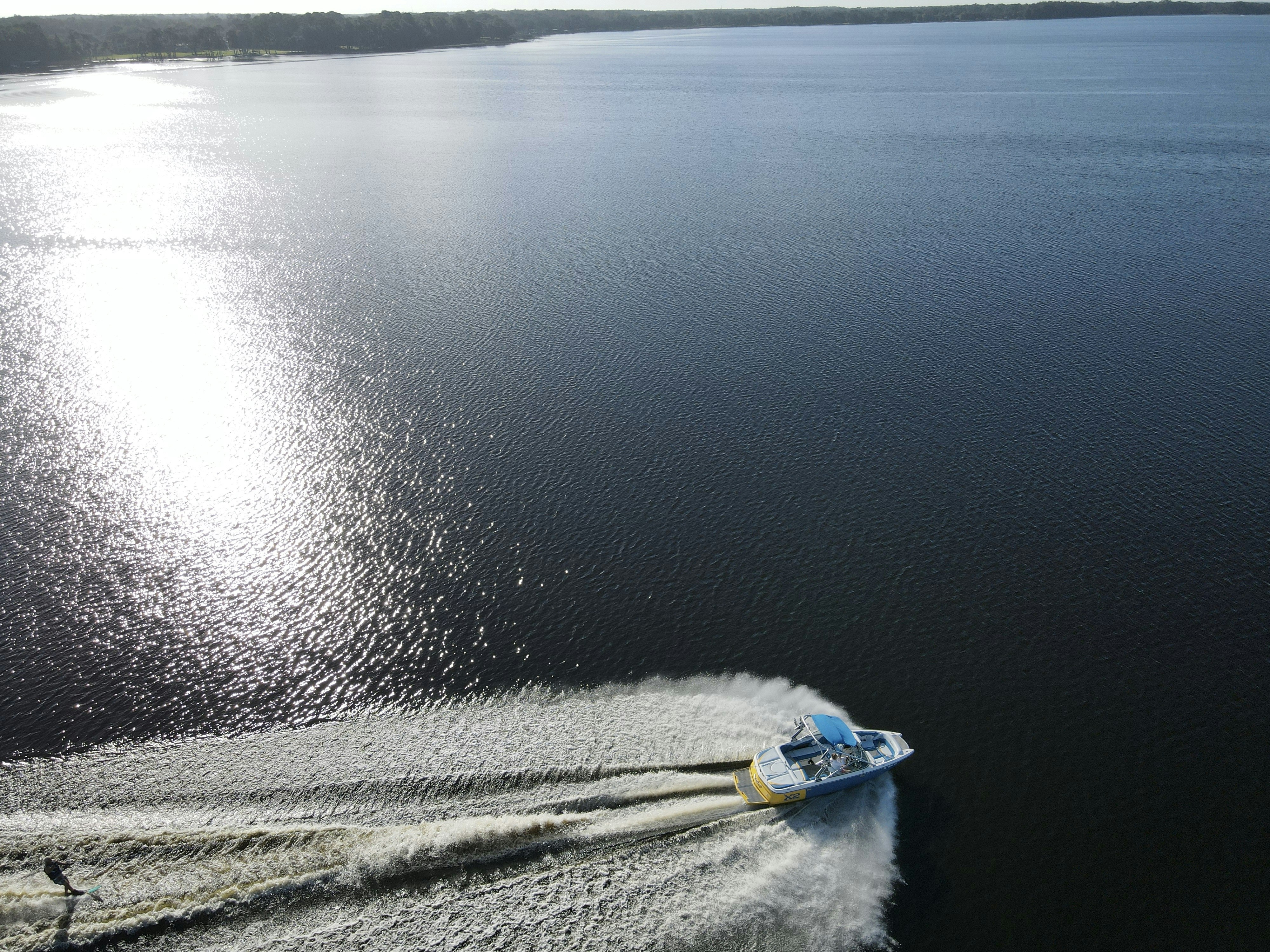 A boat traveling across a large body of water photo – Free Florida ...
