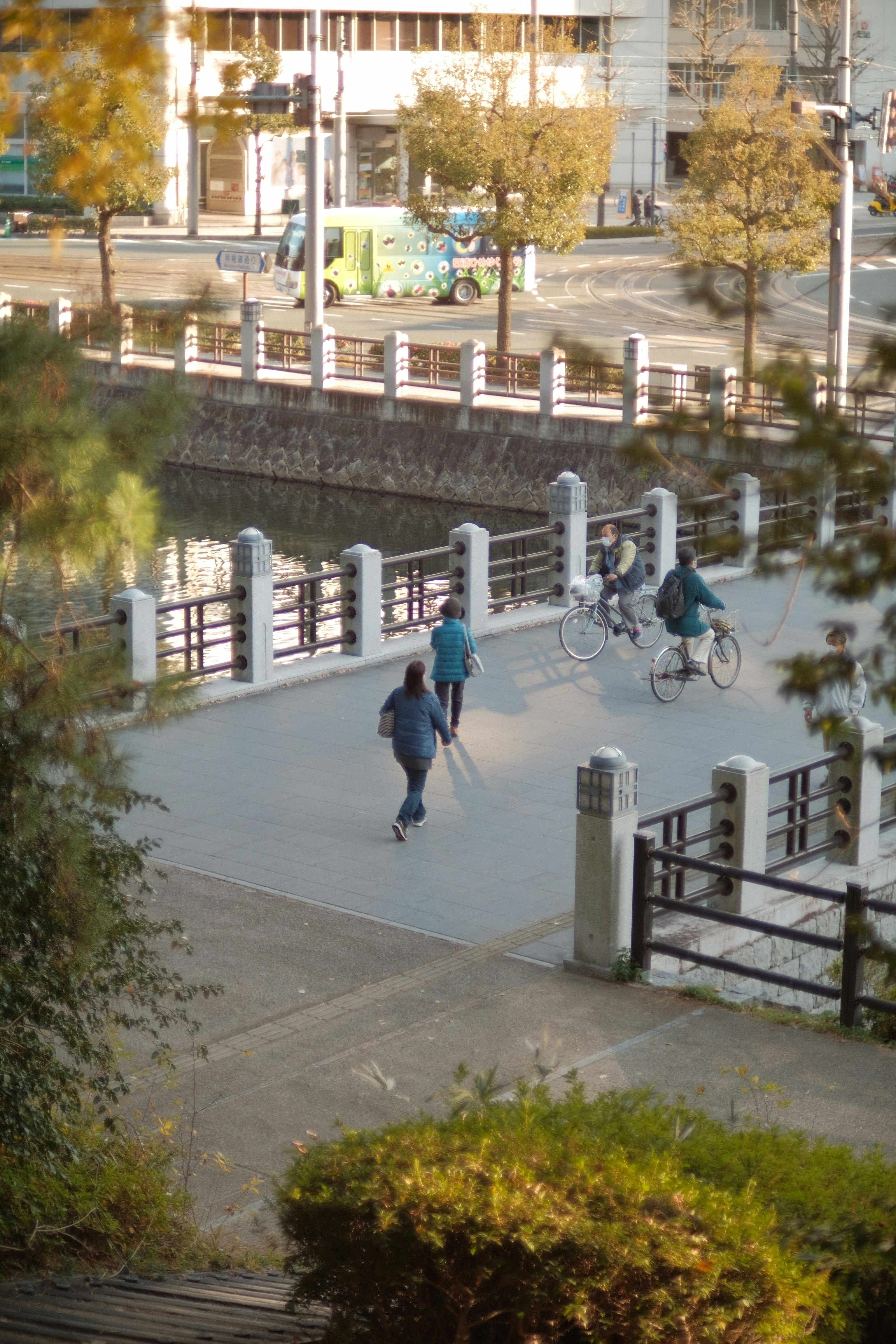 Riverside Crossing: Pedestrians and Cyclists Along the Waterfront Promenade