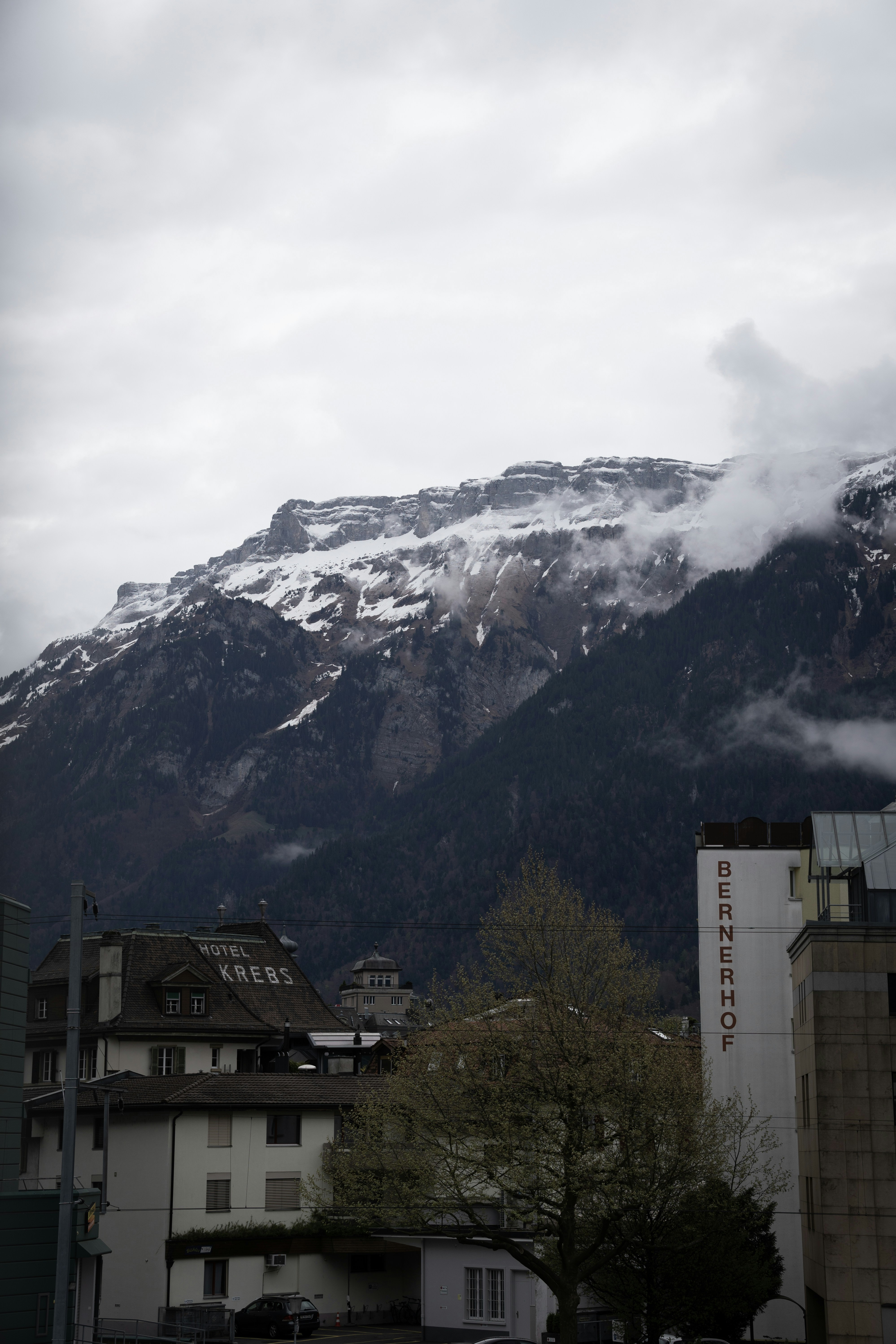Snow-tinged Alps Loom Over a Quiet Swiss Town
