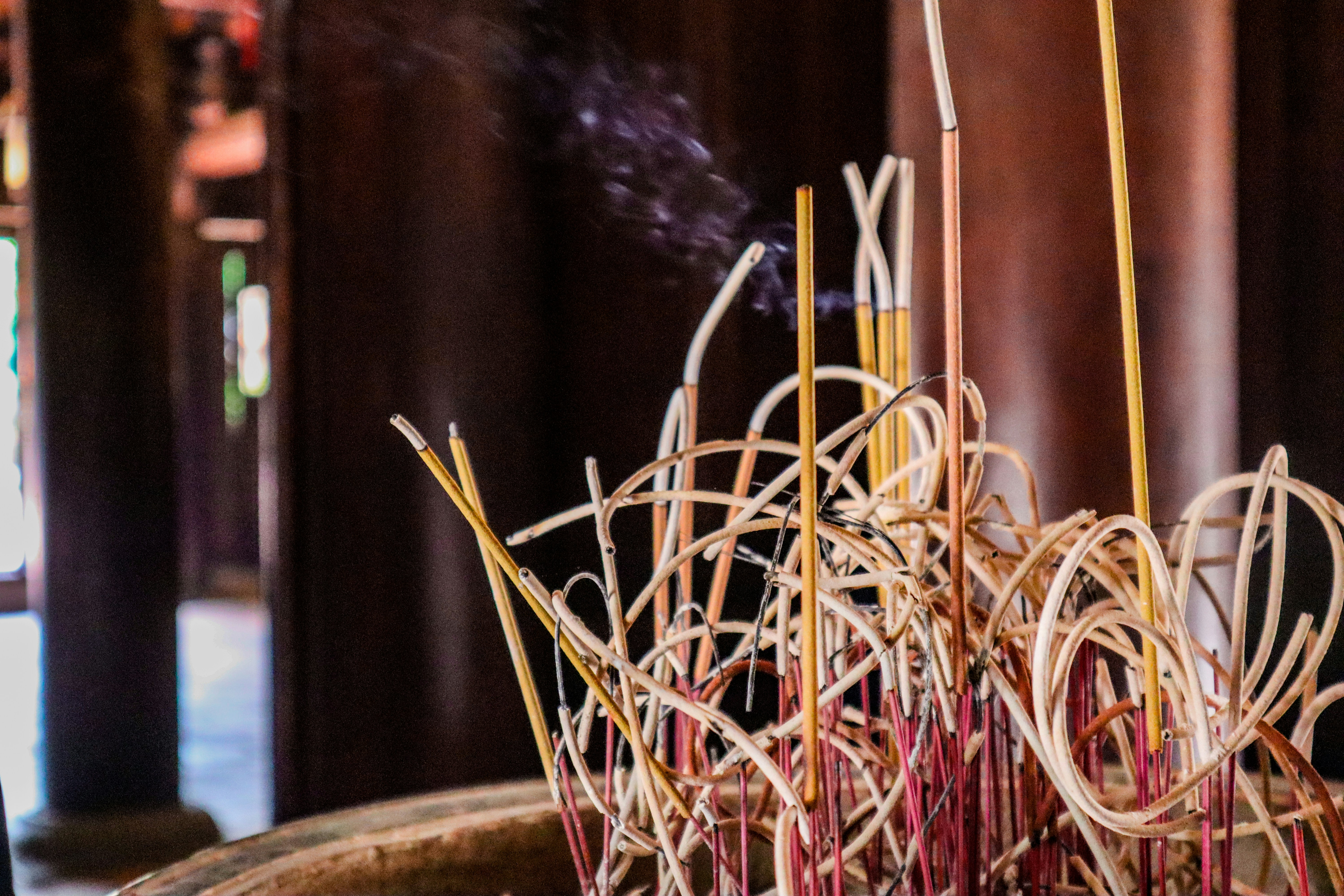 A bunch of sticks that are sitting in a barrel photo – Free Temple of ...